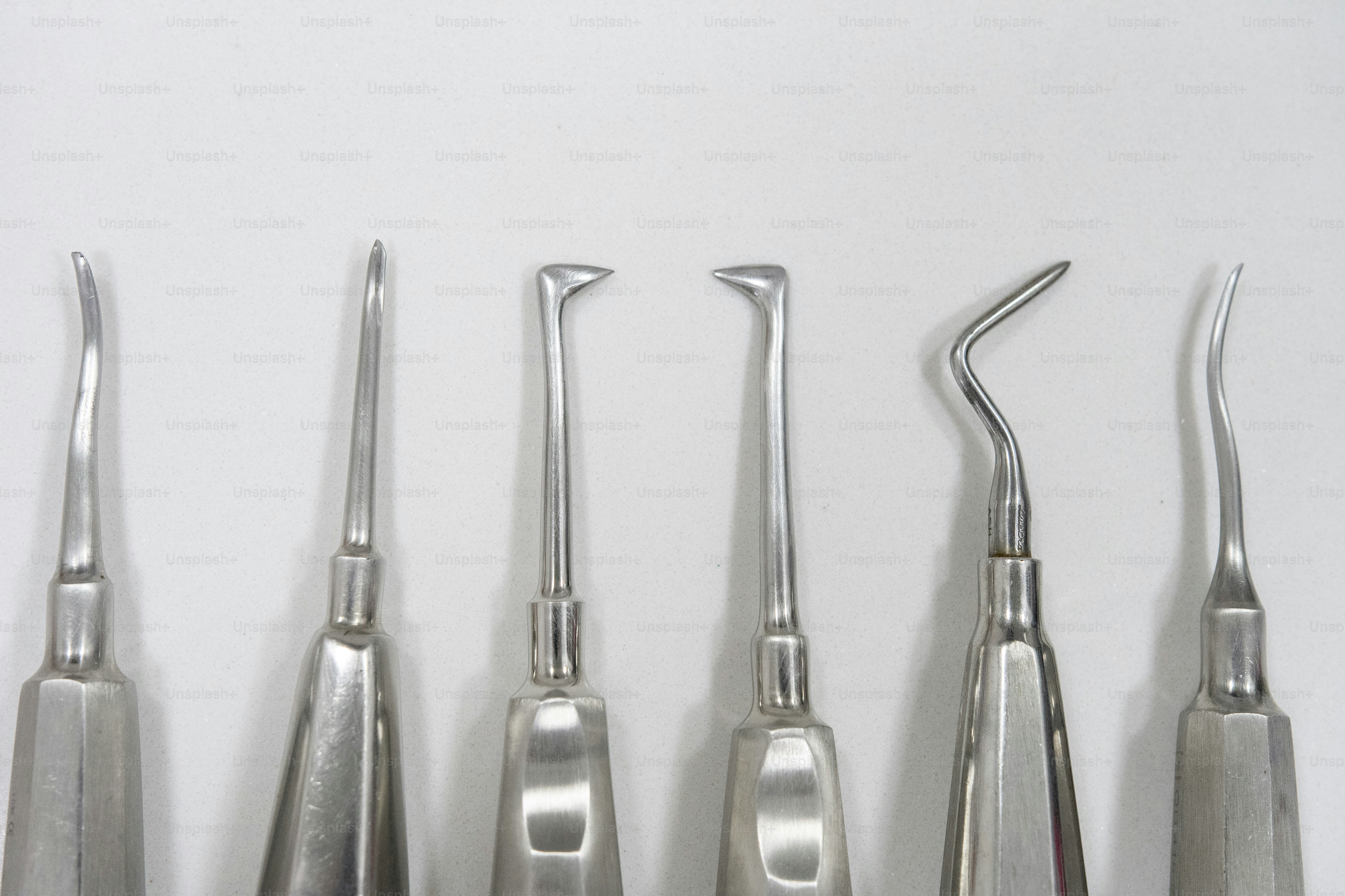 A group of dental instruments sitting next to each other photo ...