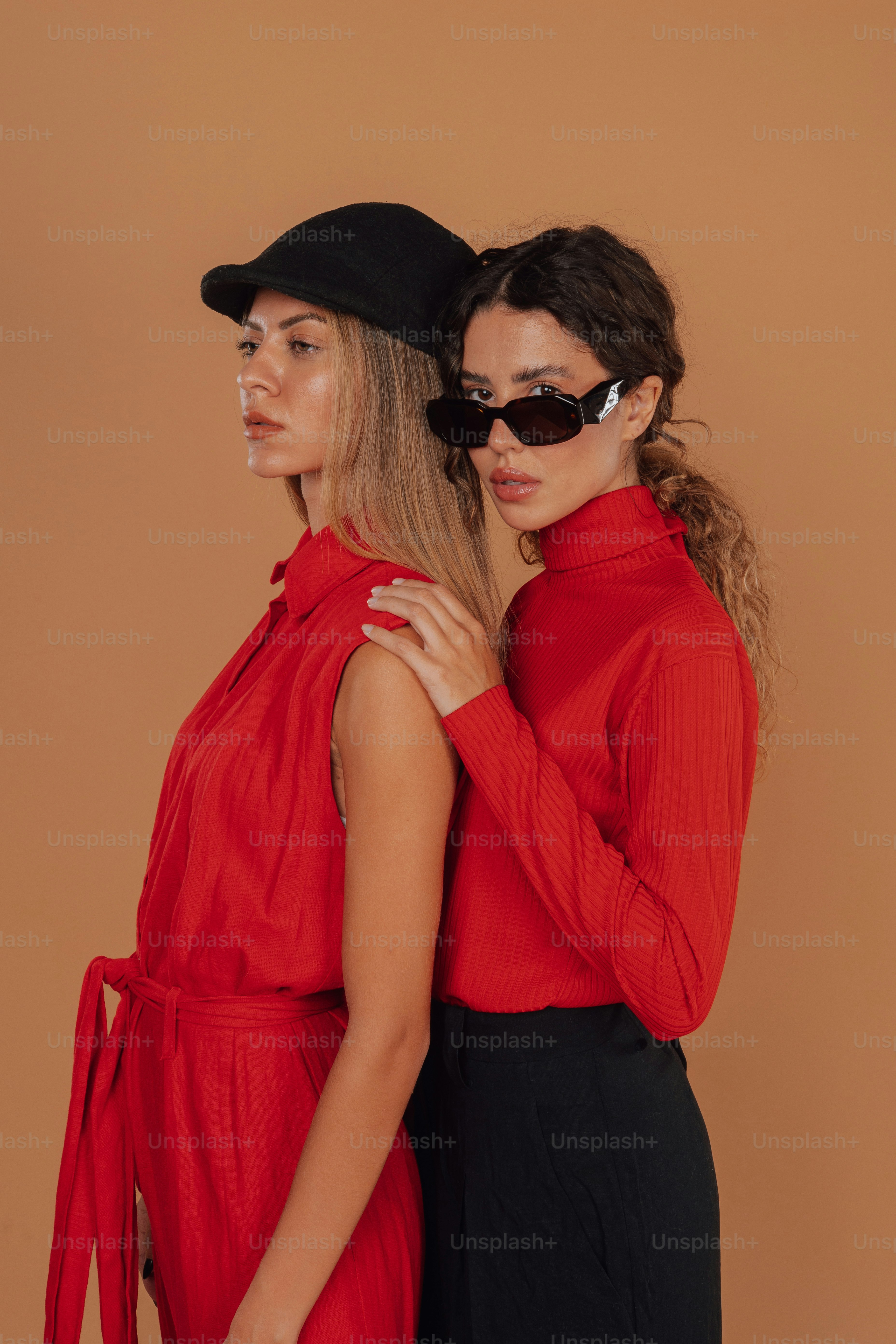 Two women in red shirts and black pants photo – Accessories Image on ...
