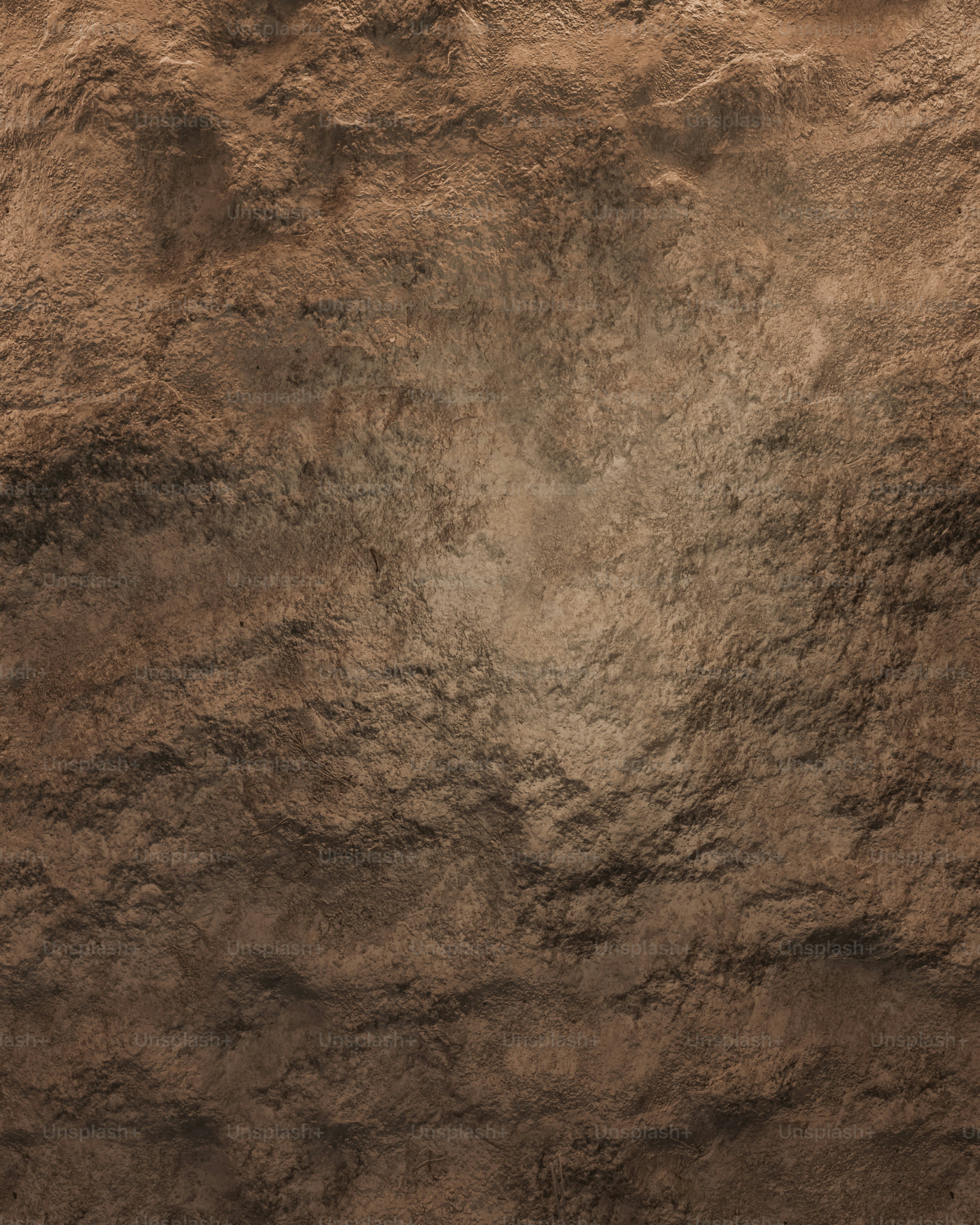 A dirt surface with a small patch of dirt in the middle of it photo – Texture Image on Unsplash