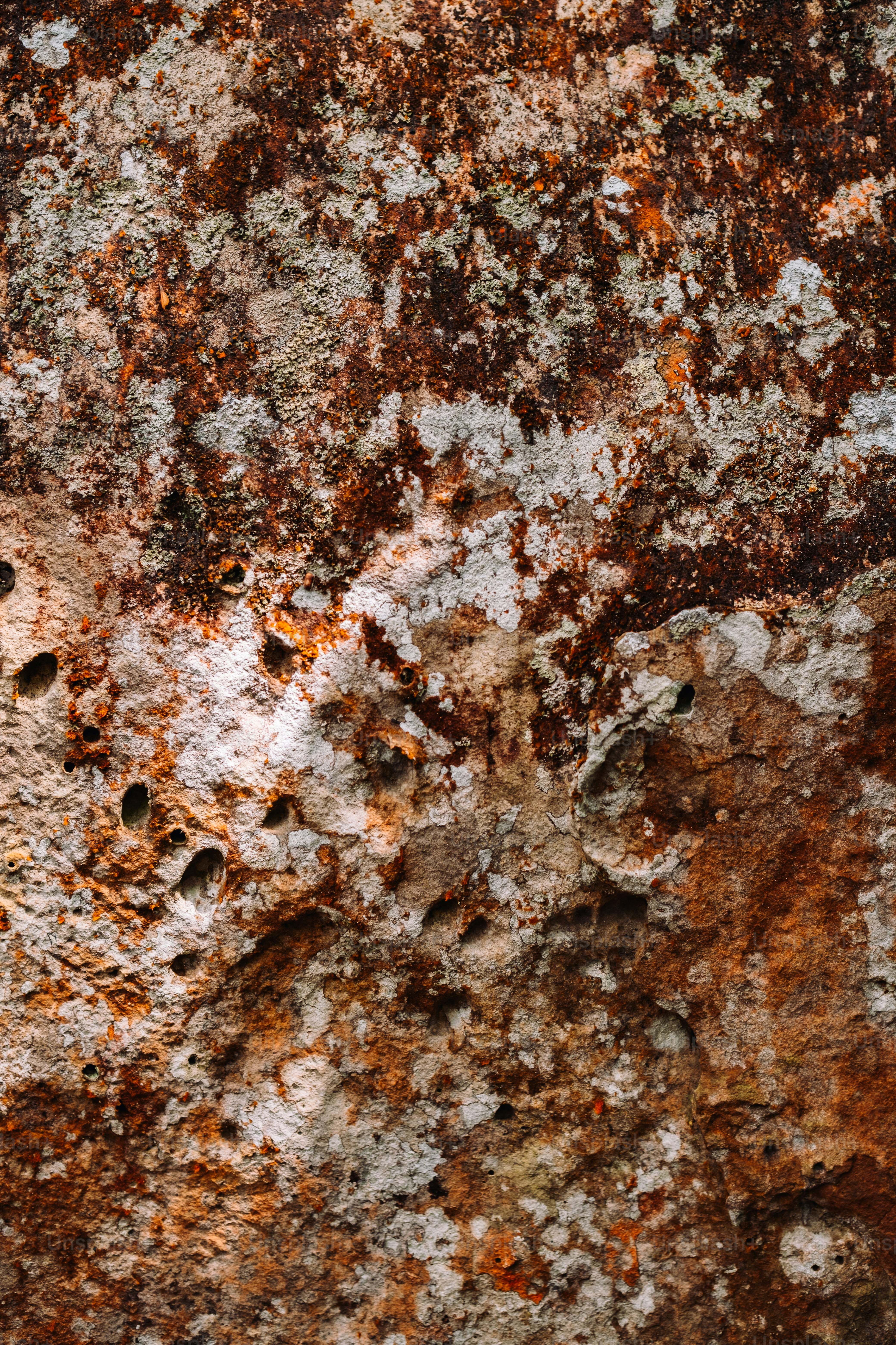 A close up of a rock with some dirt on it photo – Rust texture Image on ...