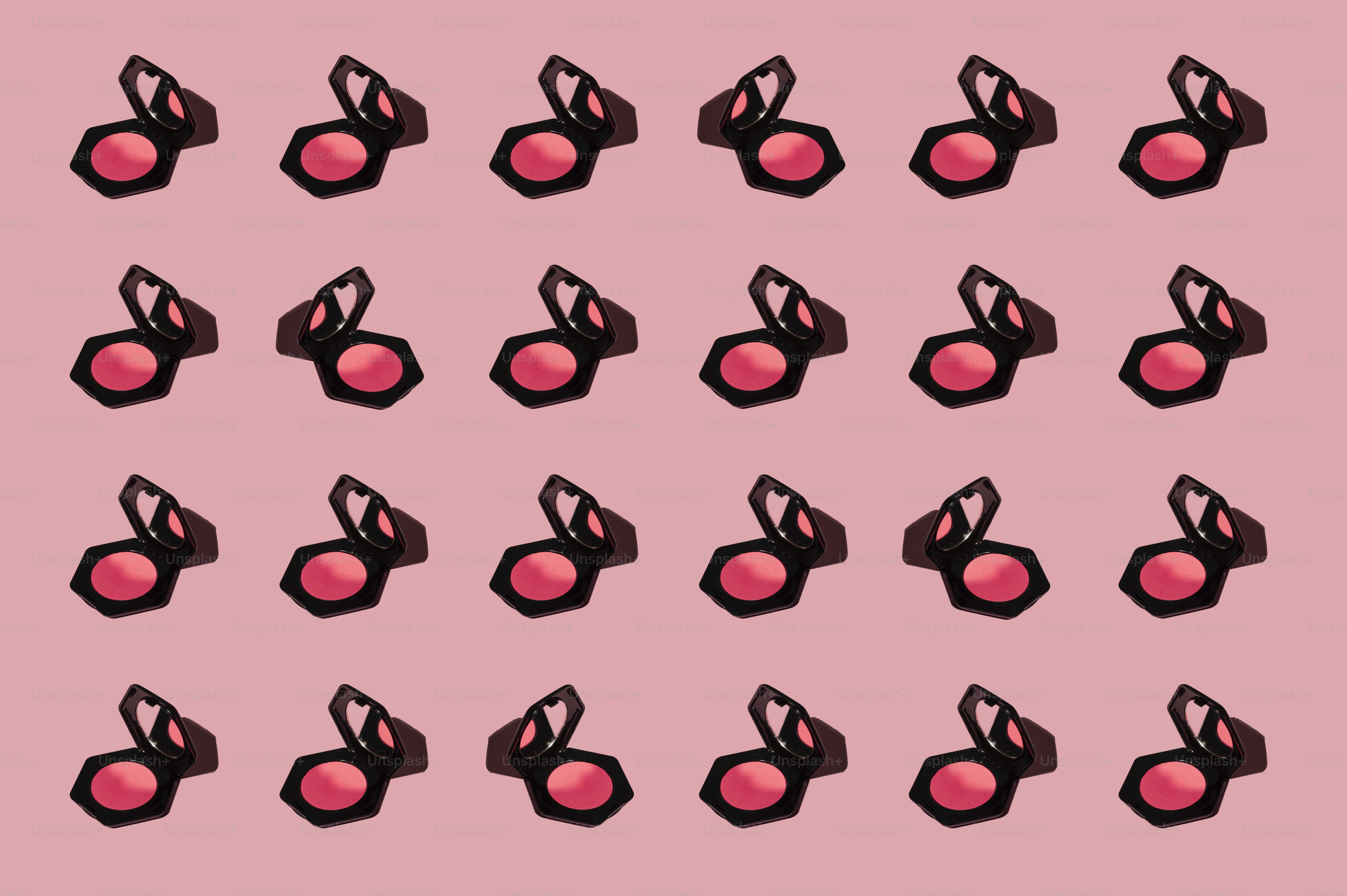 A pink background with a lot of black and pink objects photo – Pattern ...