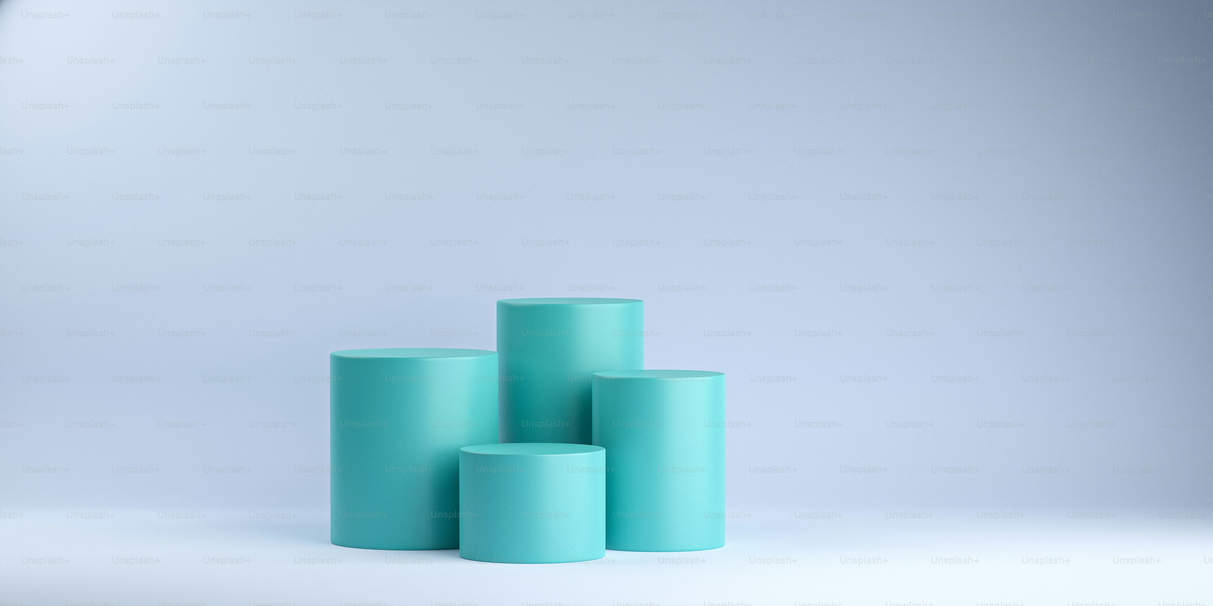 A group of blue cylinders sitting next to each other photo – Stand ...