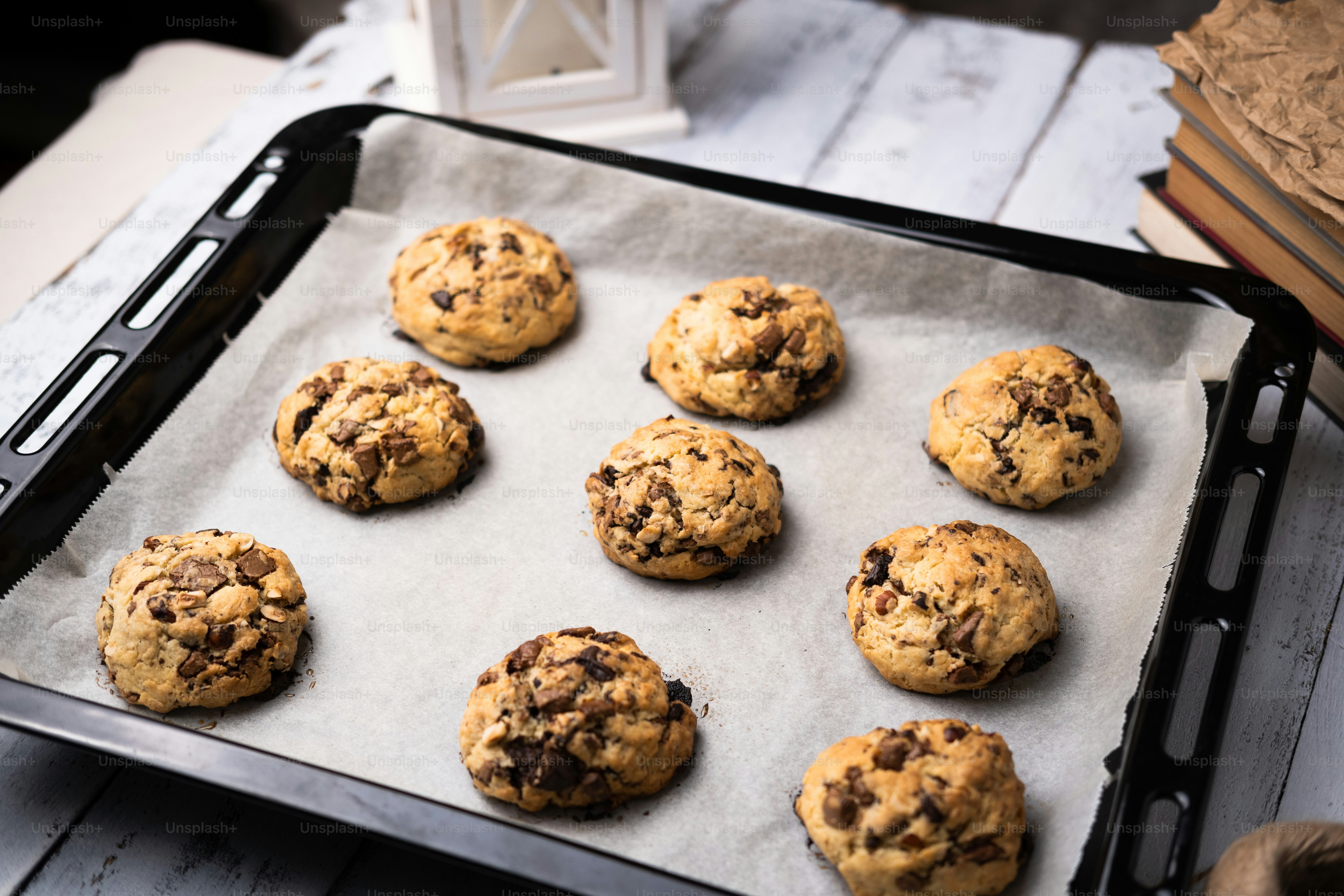 A tray of chocolate chip cookies on a table photo – Baking cookies ...