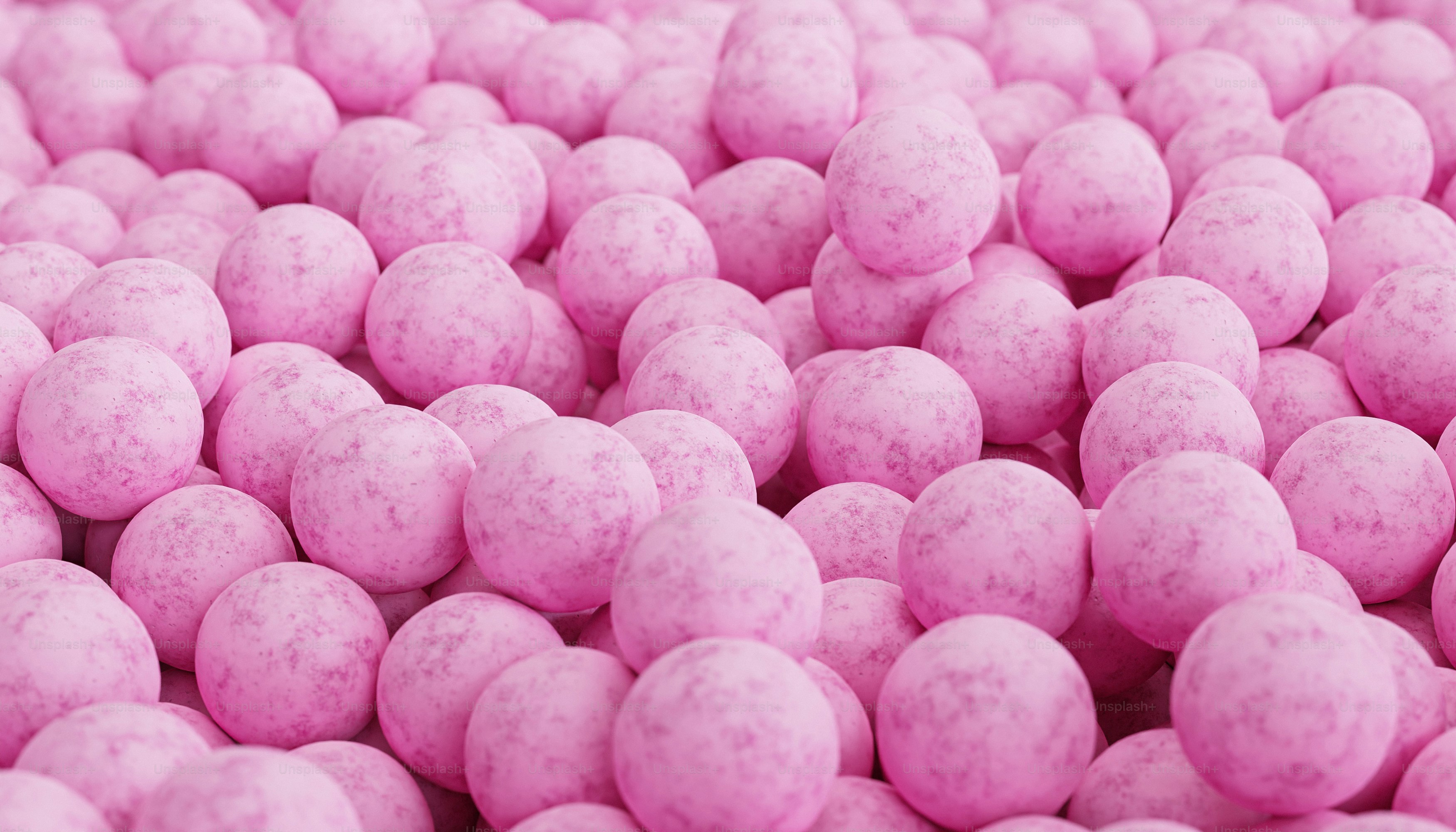 A close up of a bunch of pink candies photo – Pink Image on Unsplash