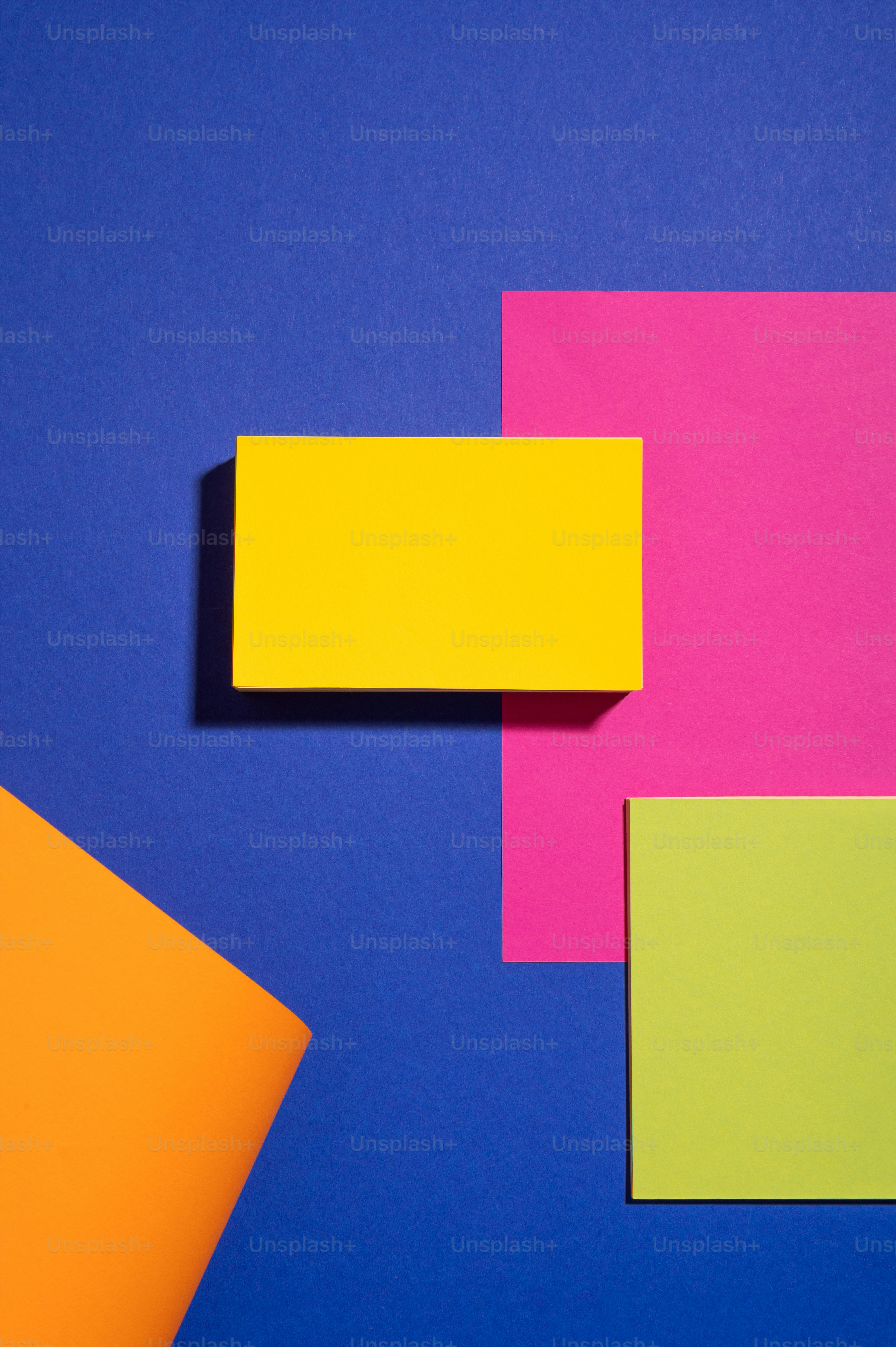 A group of different colored squares on a blue background photo ...