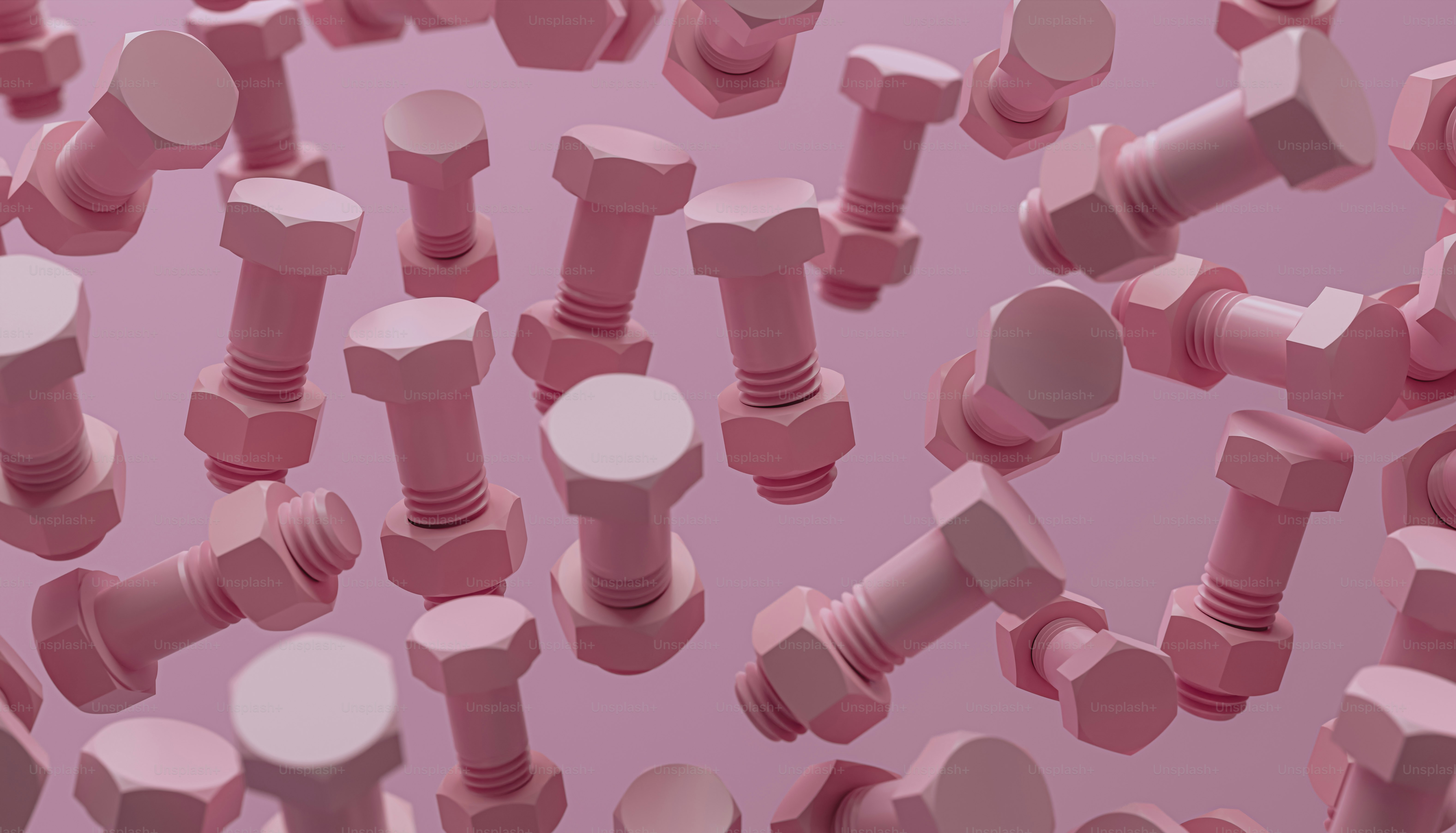 A bunch of pink screws are arranged in a pattern photo – Industry Image ...