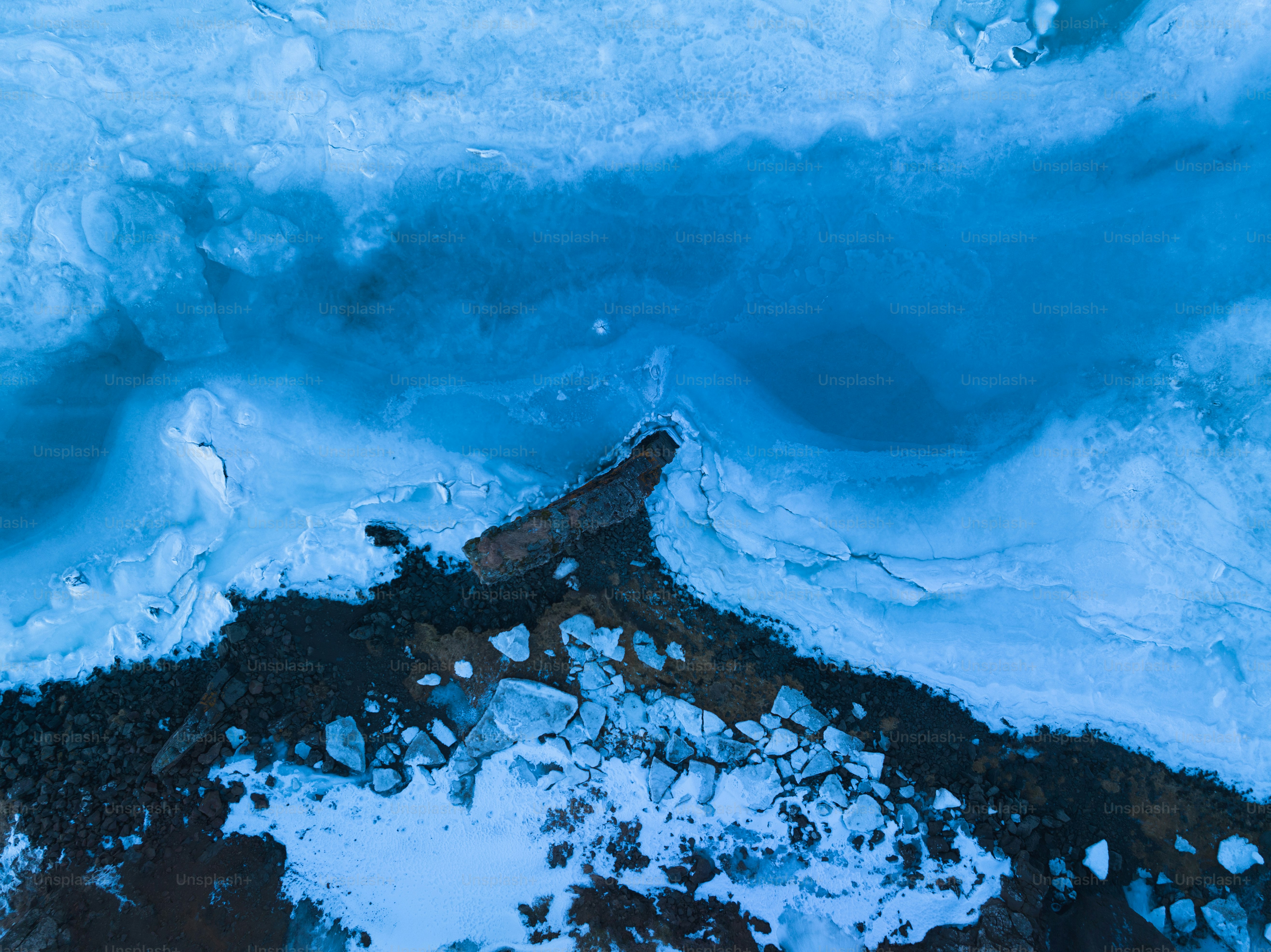 An aerial view of a snow covered area photo – Ice Image on Unsplash