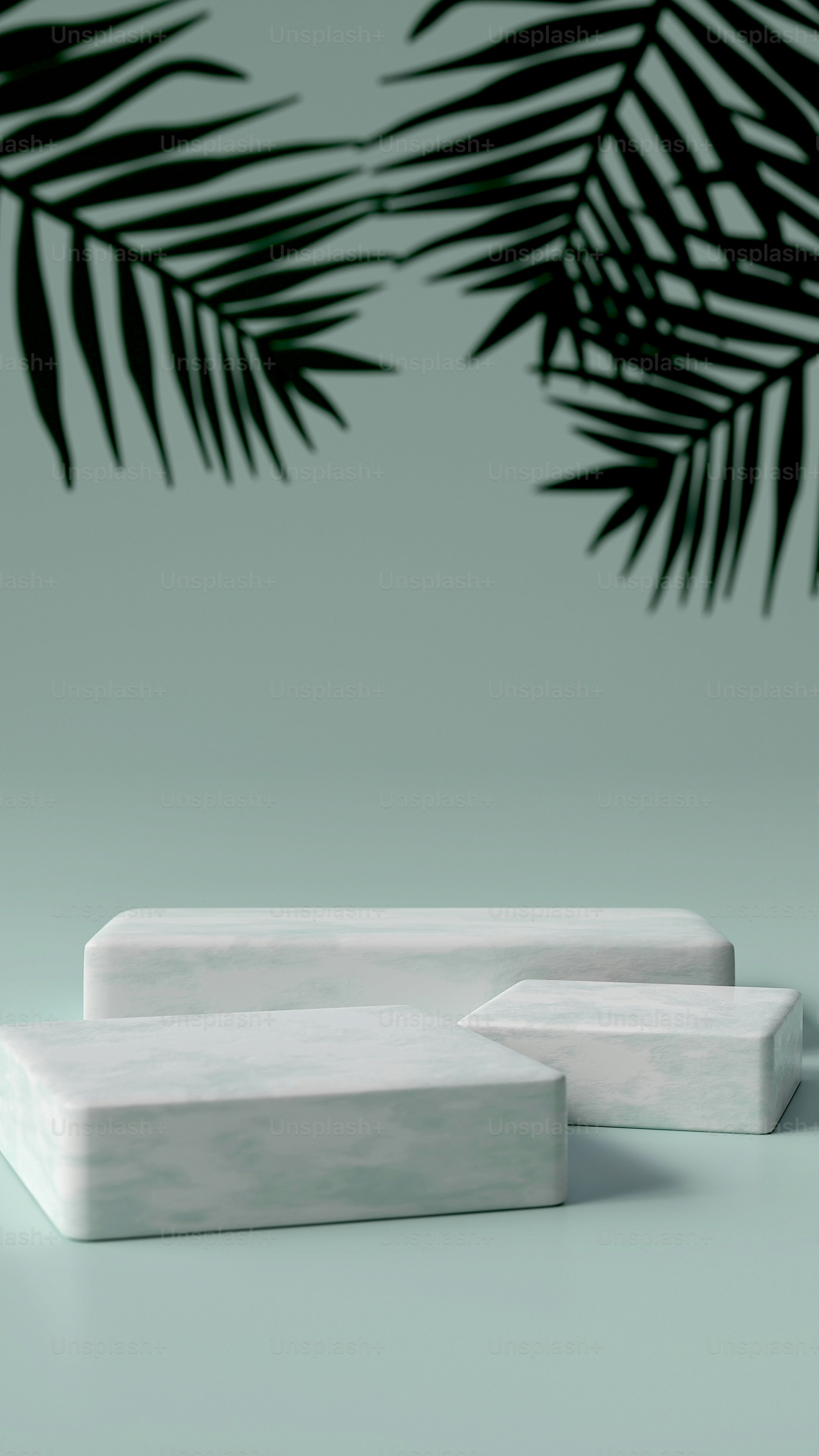 A couple of white blocks sitting on top of a table photo – Podium ...