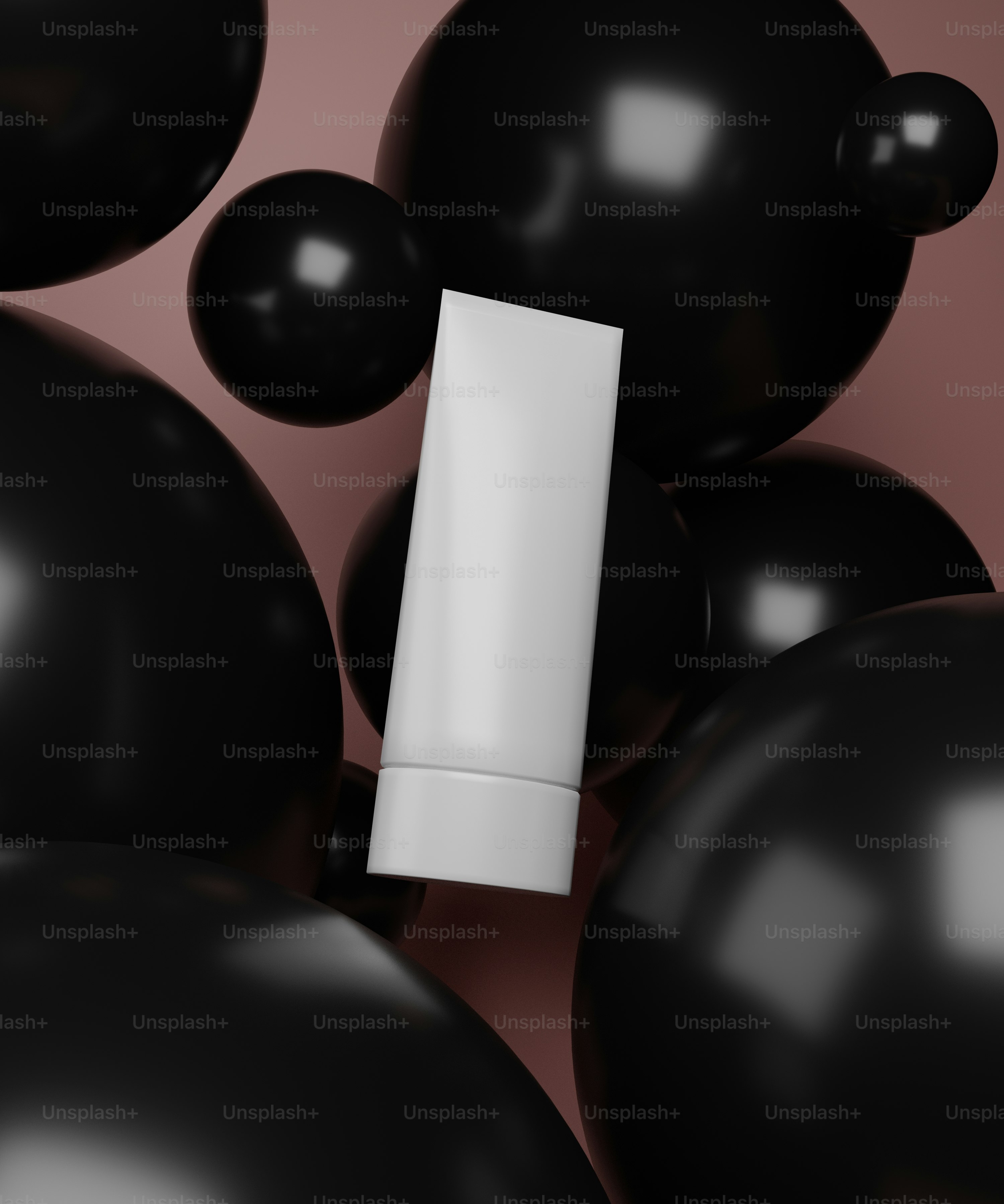A tube of toothpaste surrounded by black balloons photo – Black Image ...