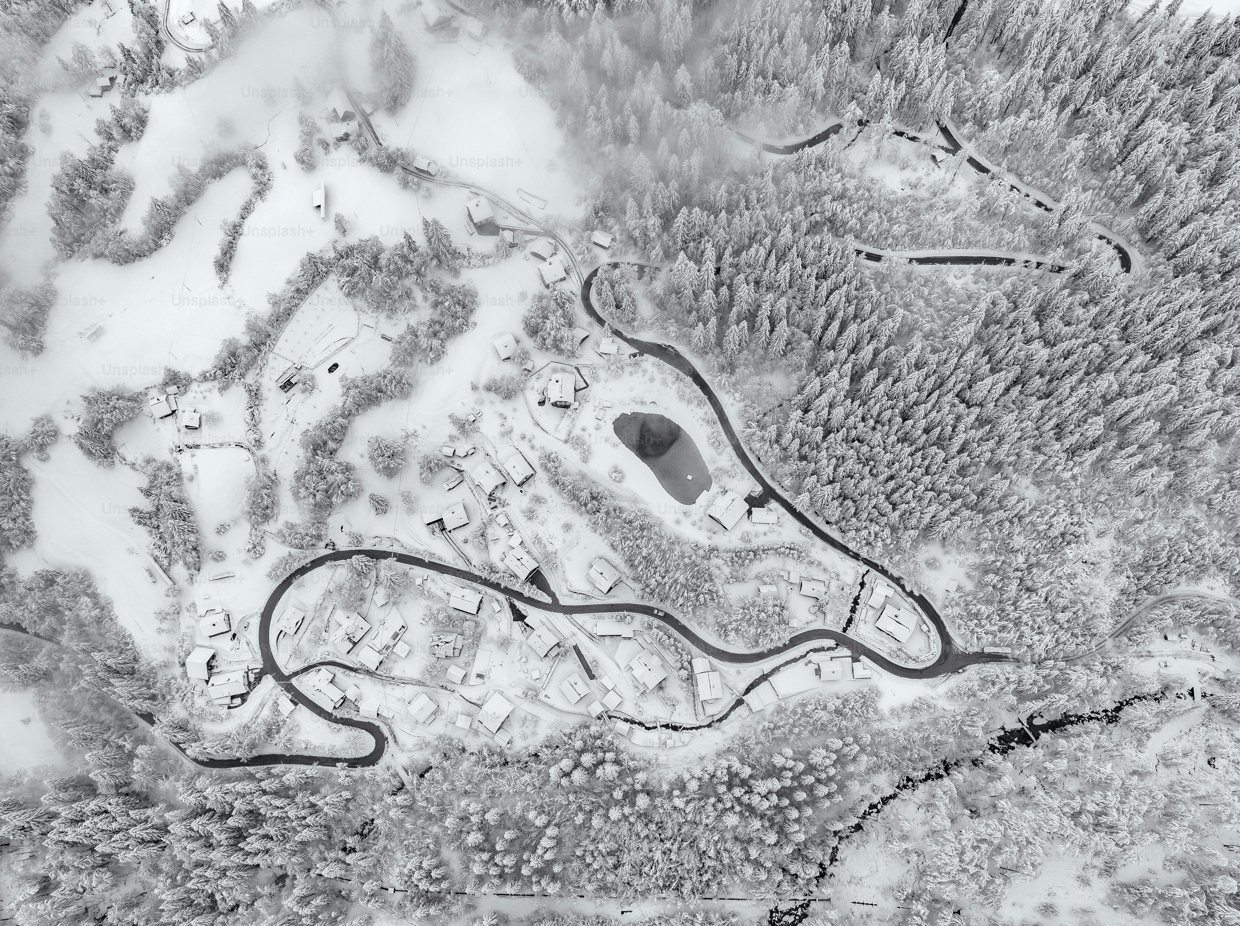 An aerial view of a snow covered area photo – Cold weather Image on ...