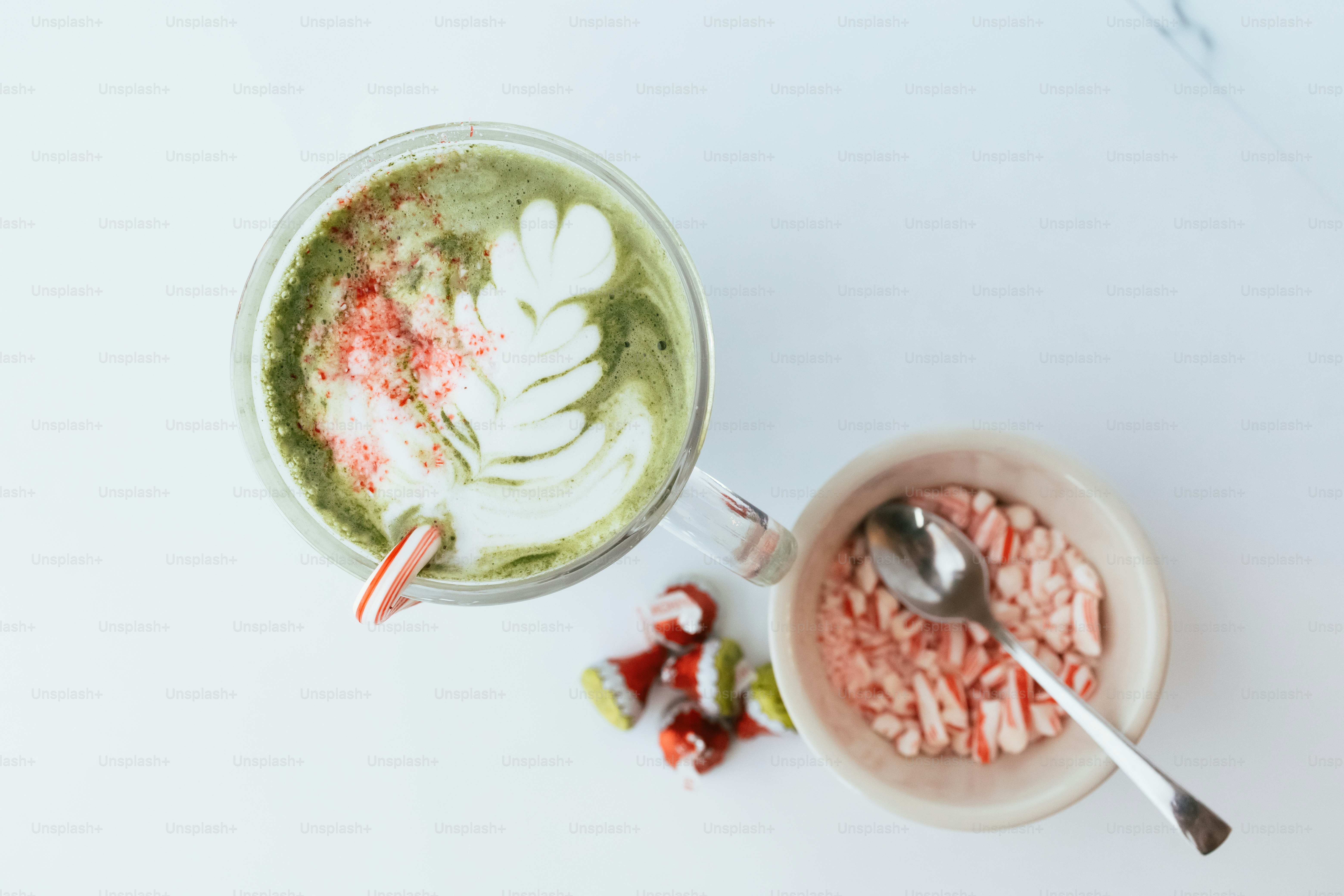 A cup of green tea and a bowl of candy canes photo – Nutrition Image on ...