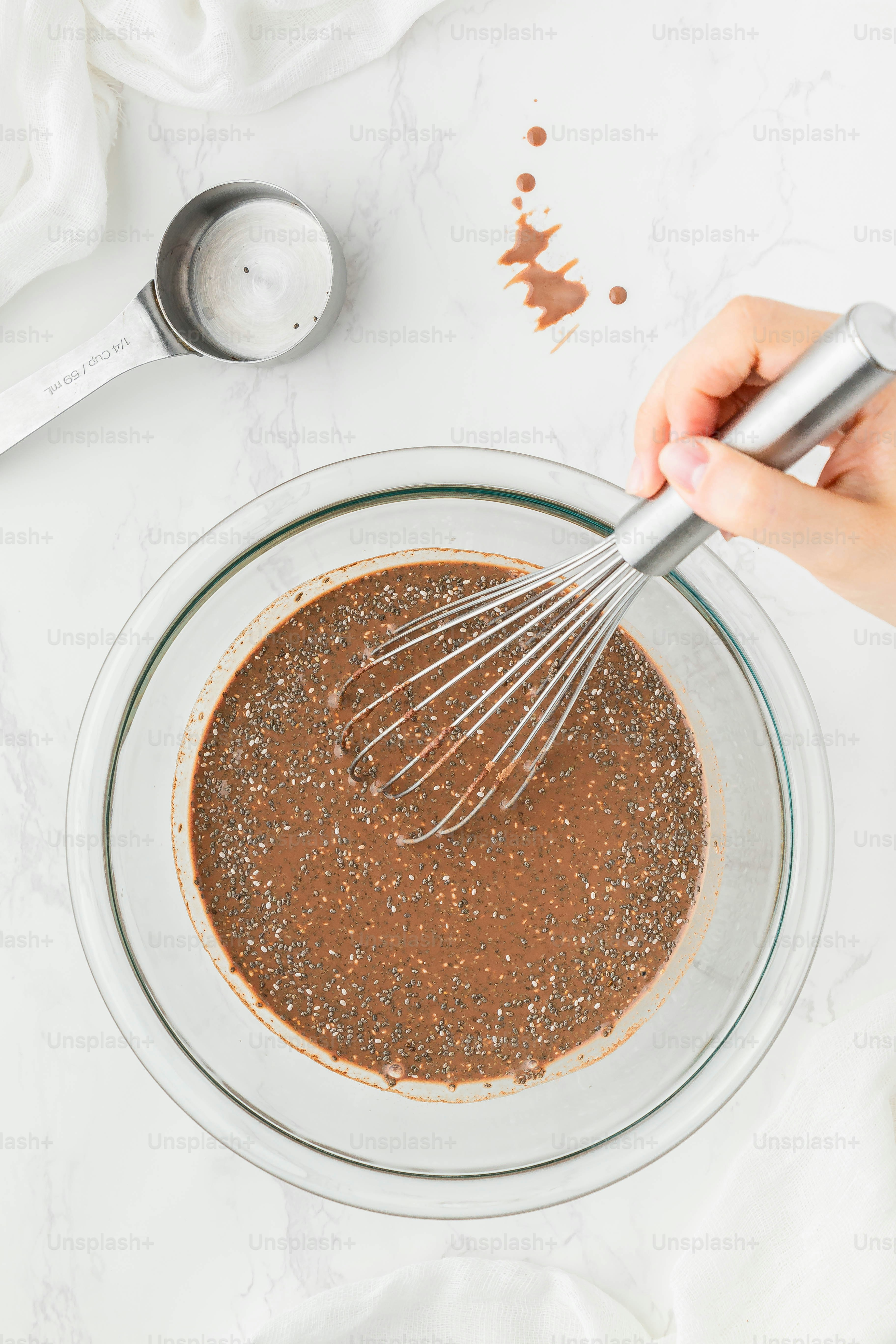 A person whisking a mixture in a glass bowl photo – Whisk Image on Unsplash