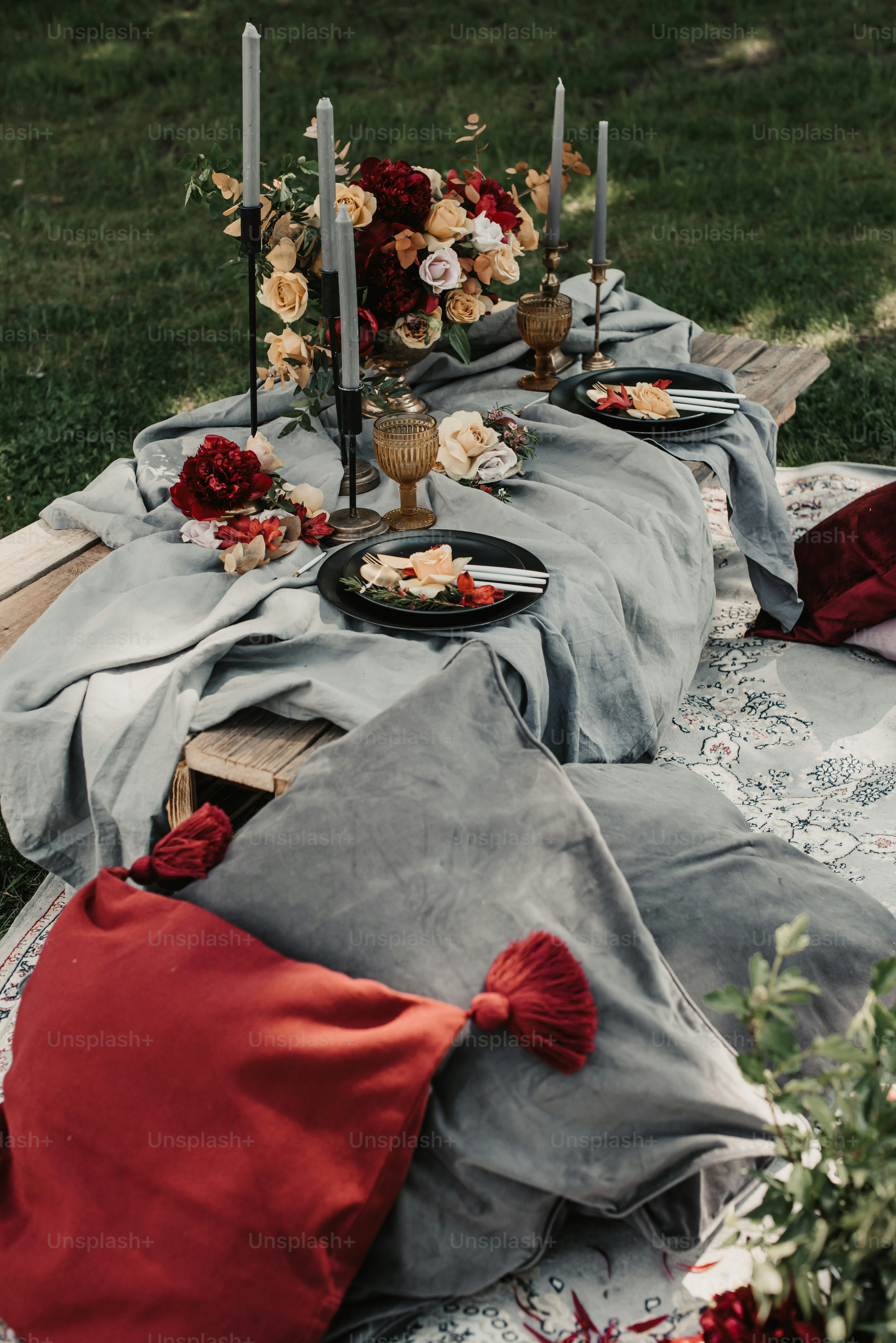 A table with a cloth covered table cloth and candles on it photo ...
