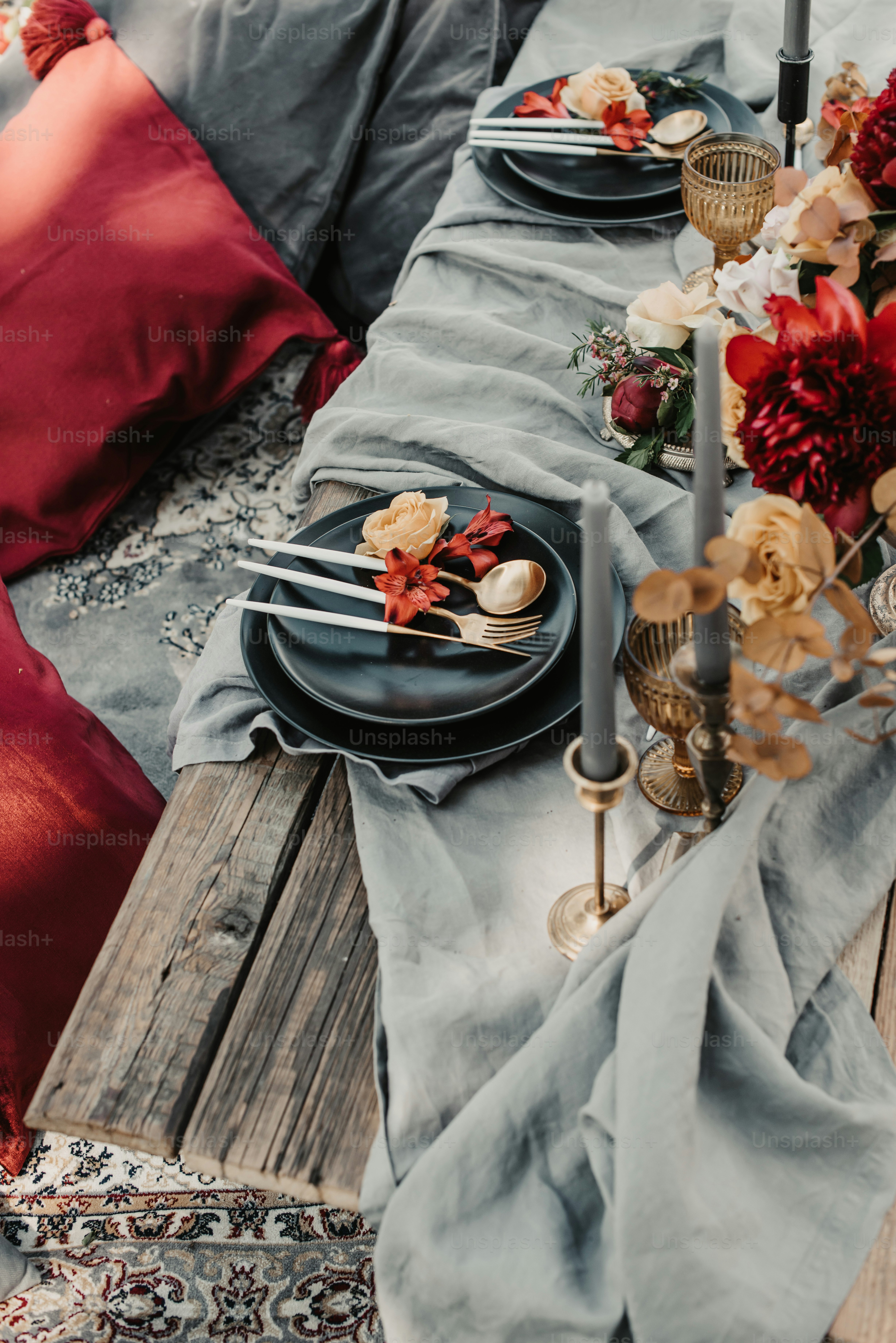 A table set with plates and silverware on a wooden table photo ...