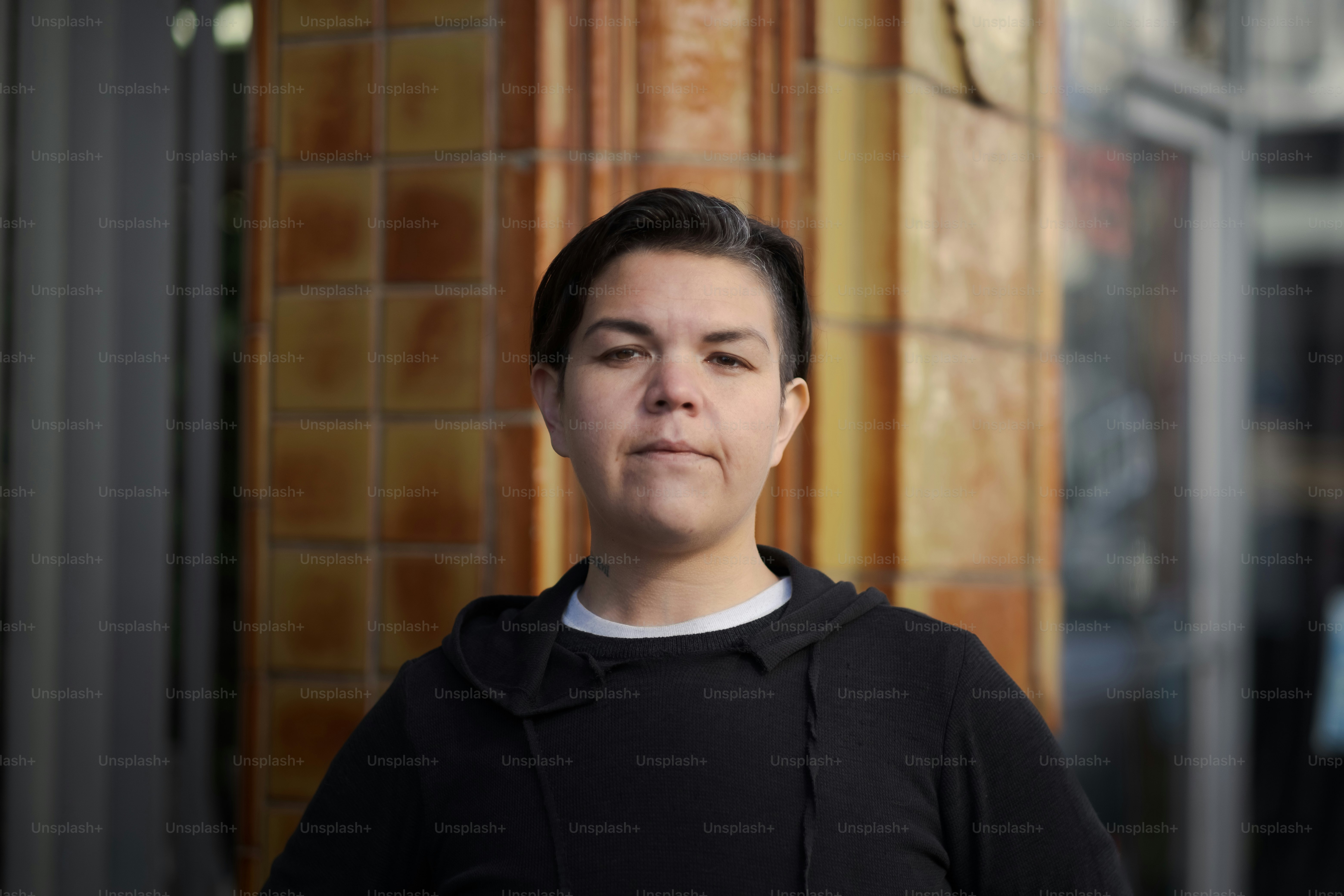A woman standing in front of a building photo – Multiracial Image on ...