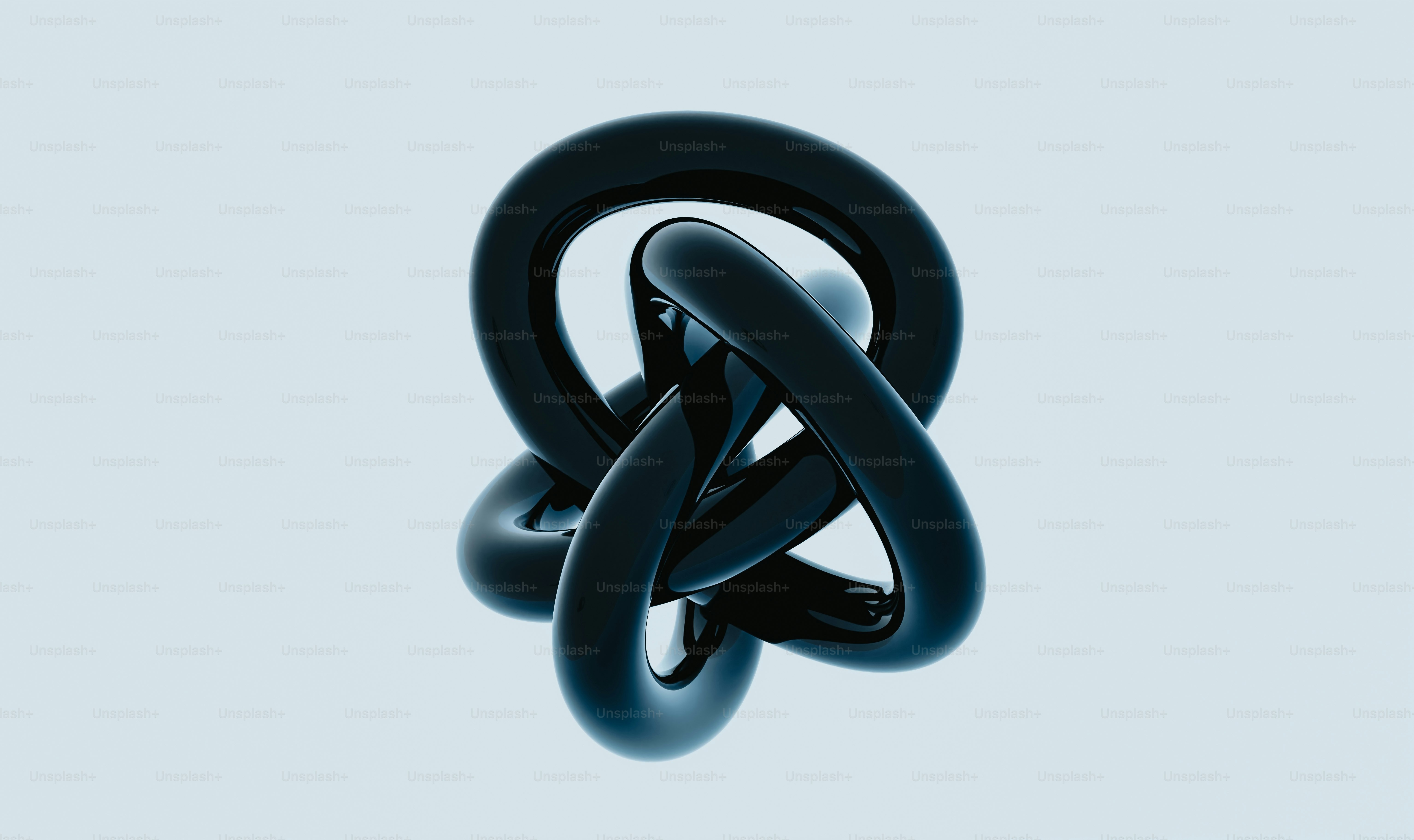 A black object with a knot in the middle of it photo – Knot Image on ...