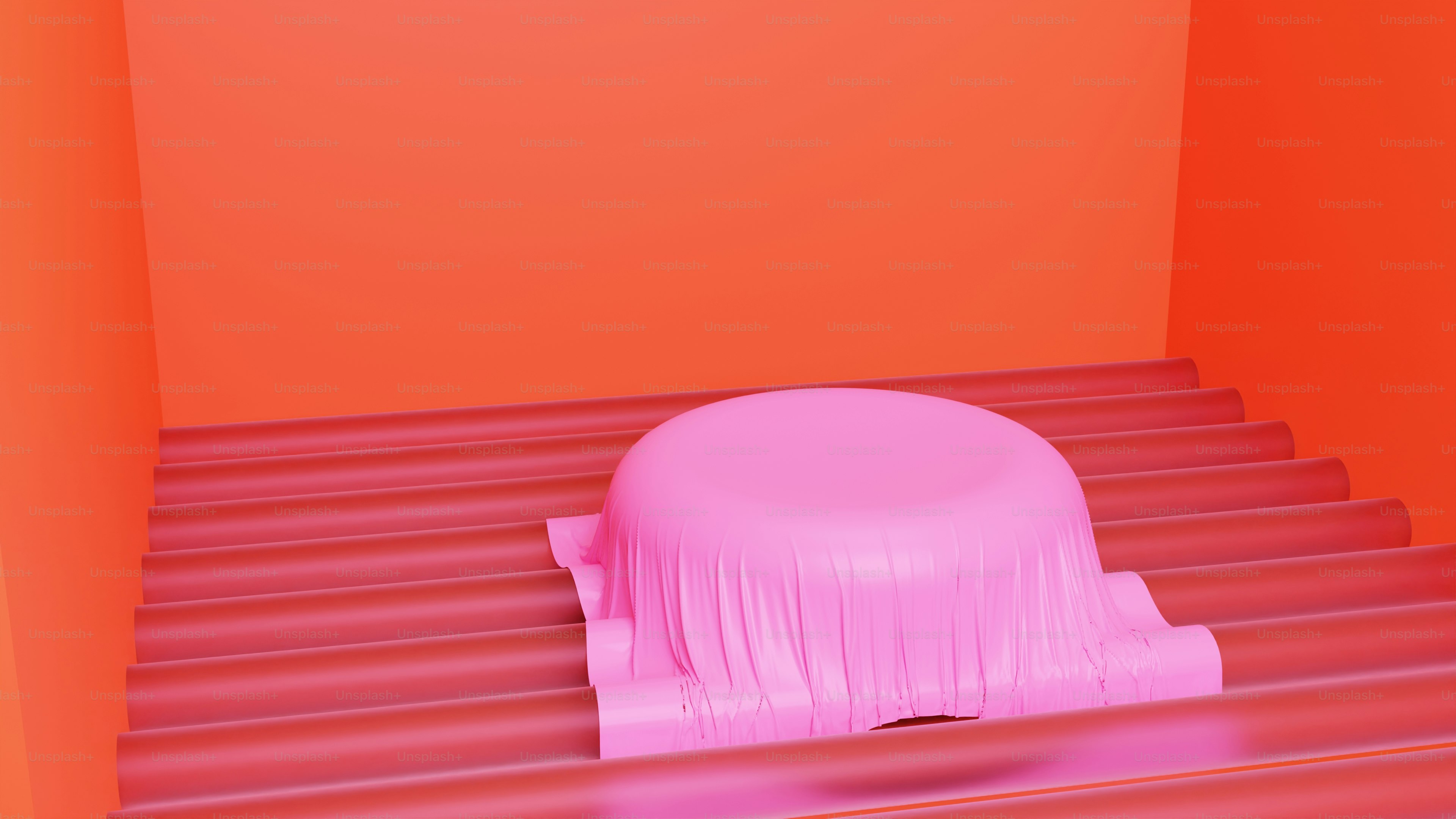 A pink object sitting on top of a red floor photo – 3d Image on Unsplash