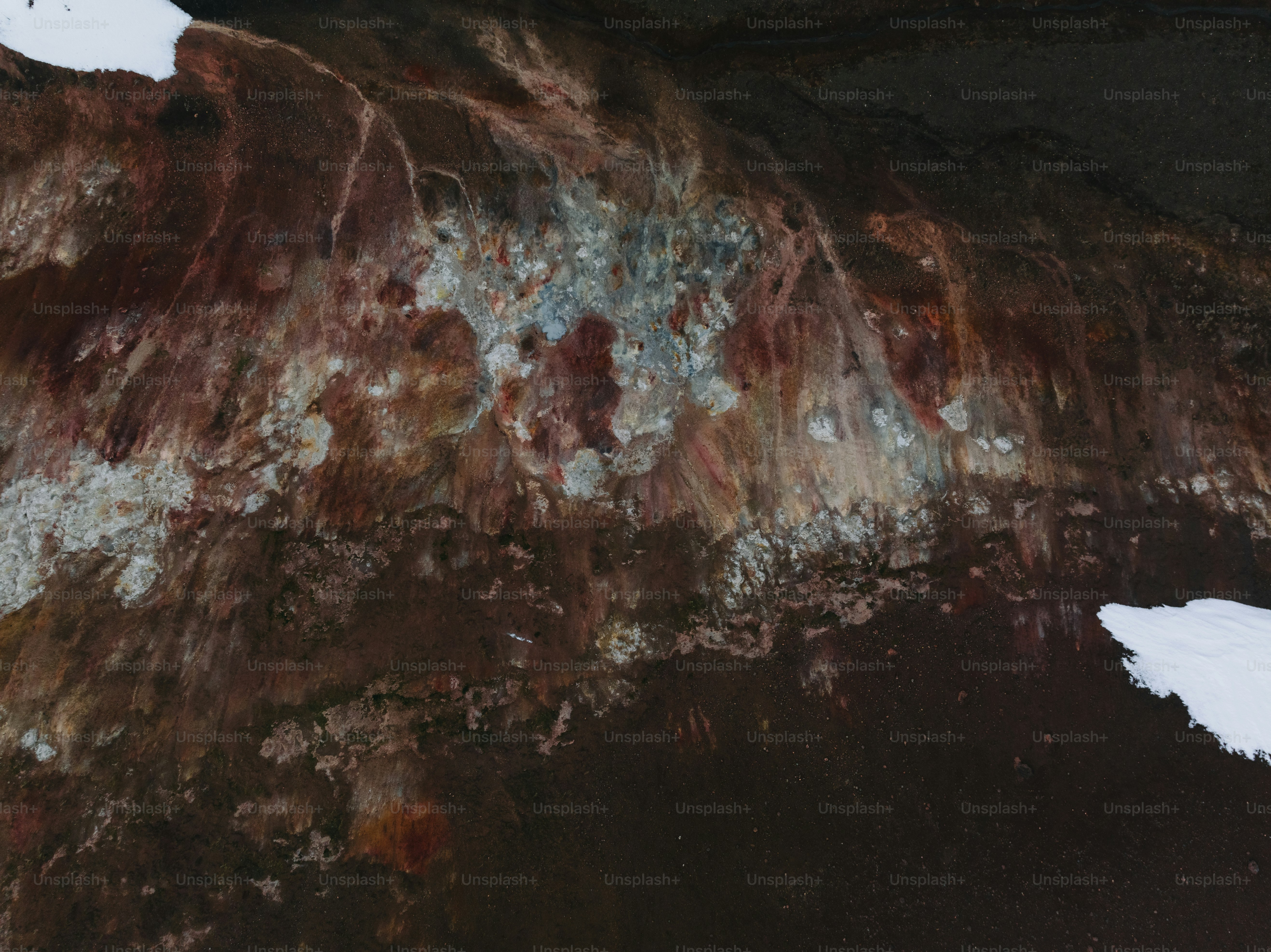 A very large rock with some snow on top of it photo – Land Image on ...