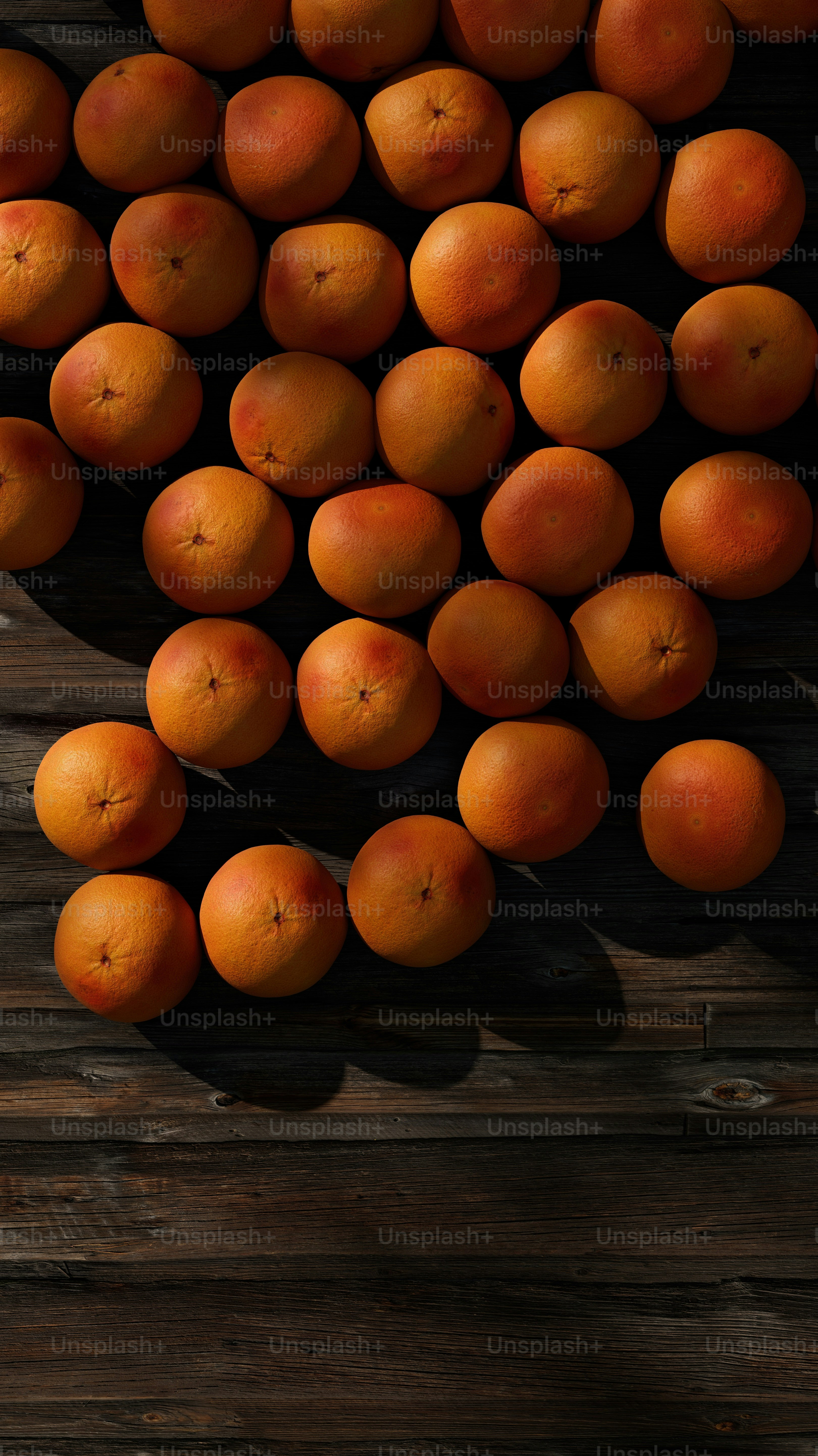 A pile of mangoes sitting on top of each other photo – Mango Image on ...