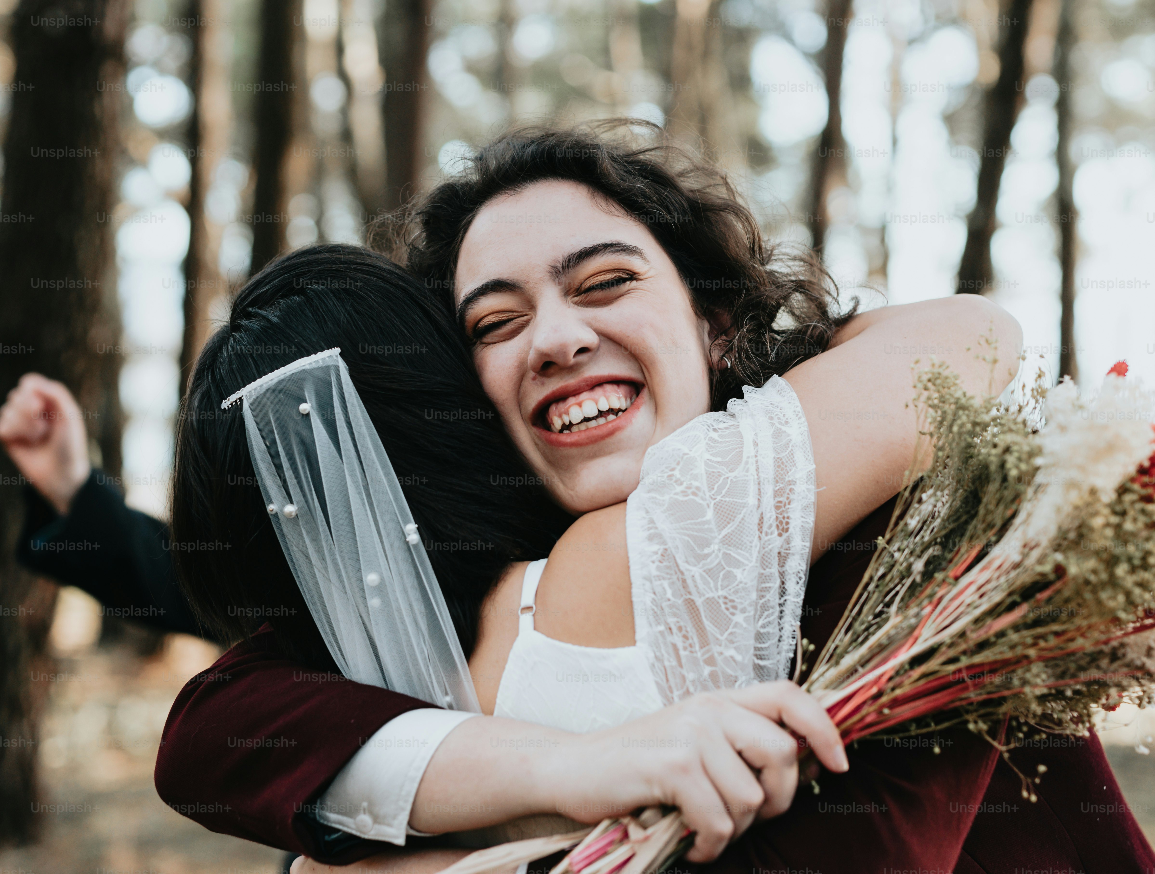 A couple of people that are hugging each other photo – Happy Image on ...