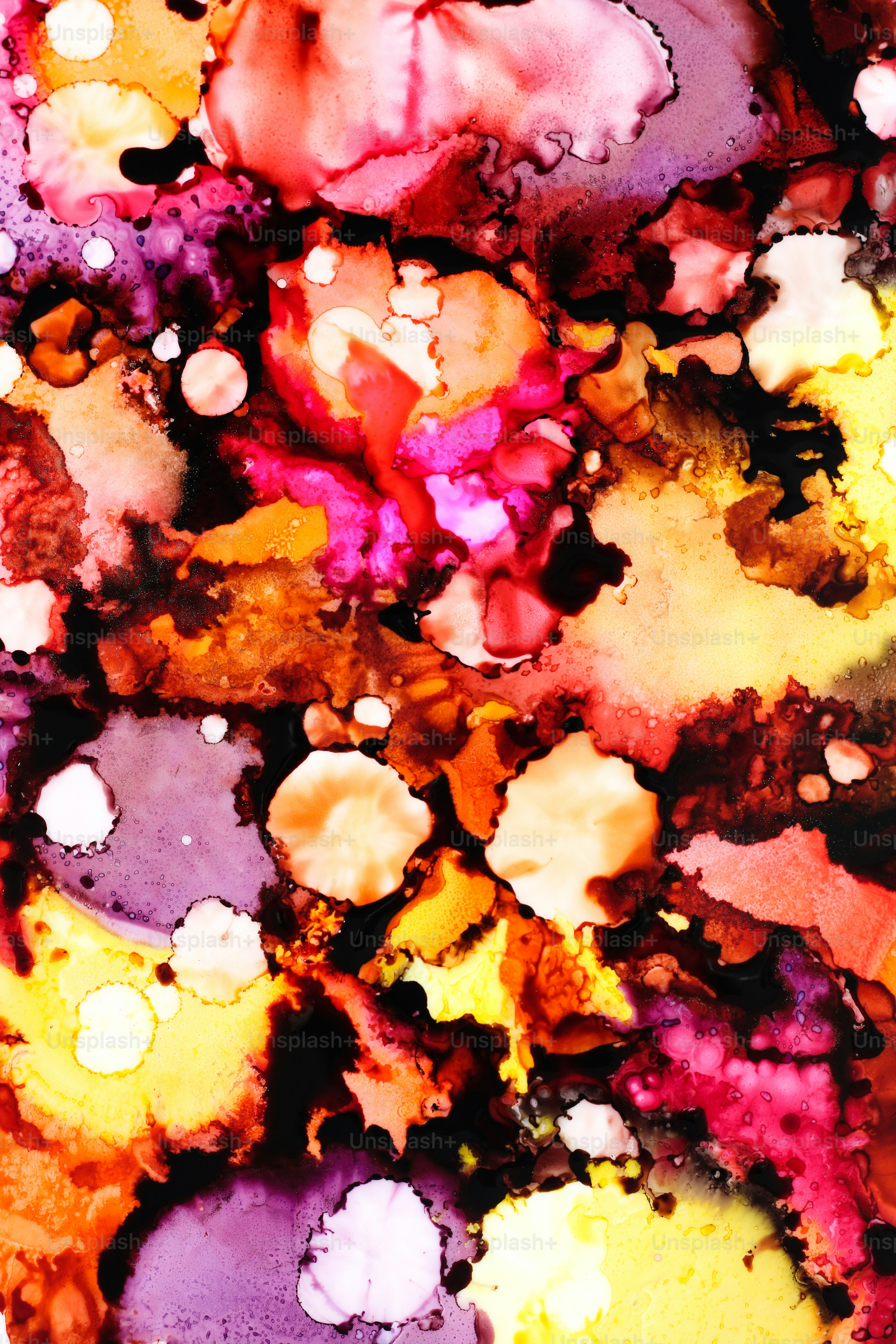 A mixture of different colors of paint on a white surface photo ...