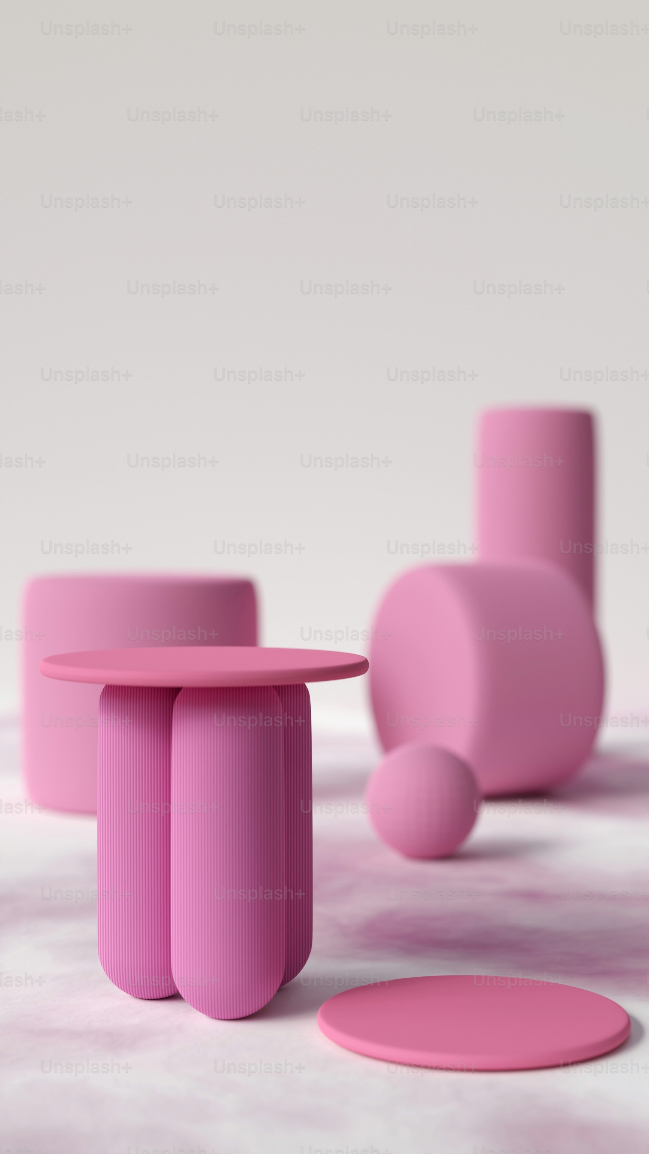A group of pink tables and stools on a white surface photo – Podium ...
