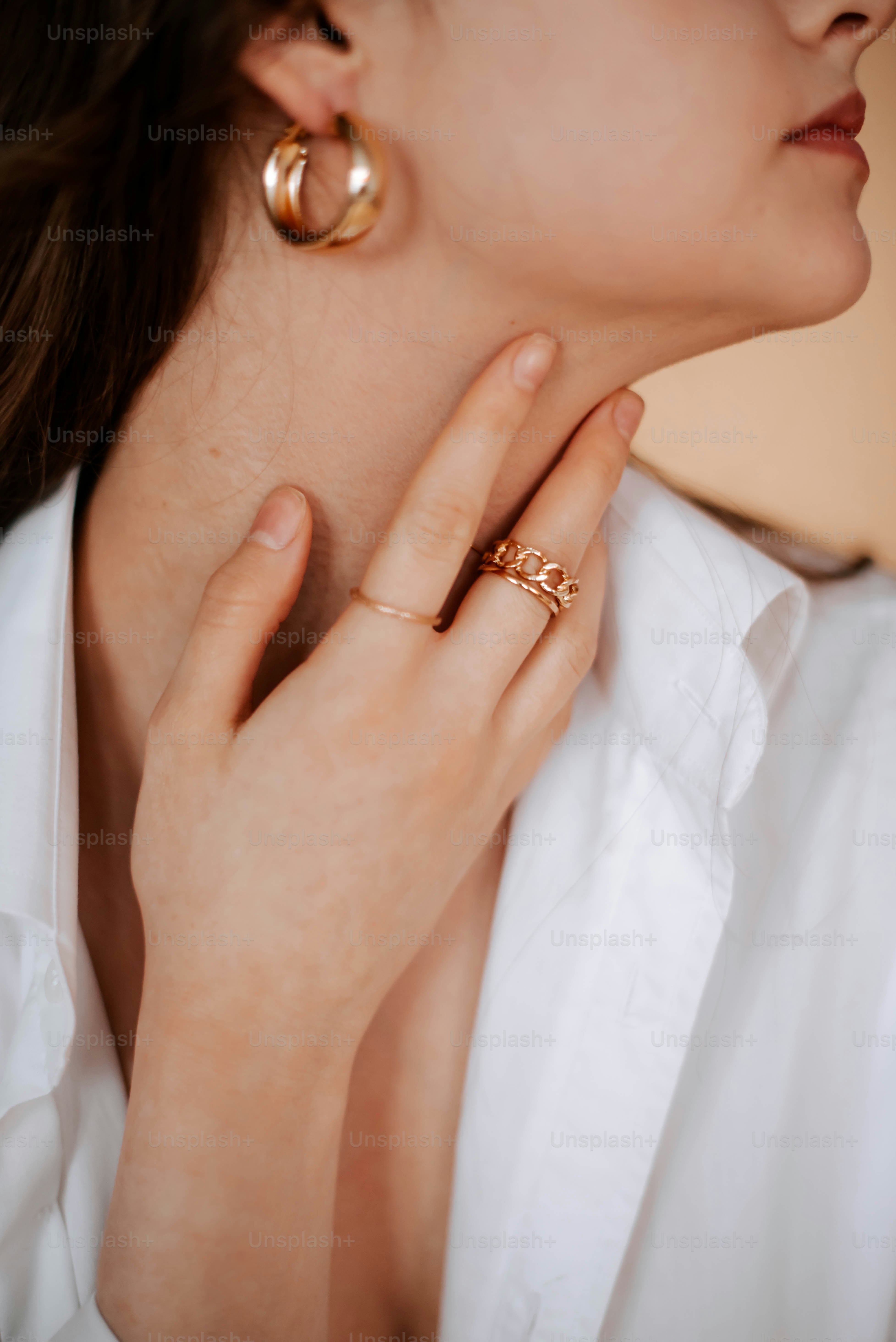 A close up of a person wearing a ring photo – No face Image on Unsplash