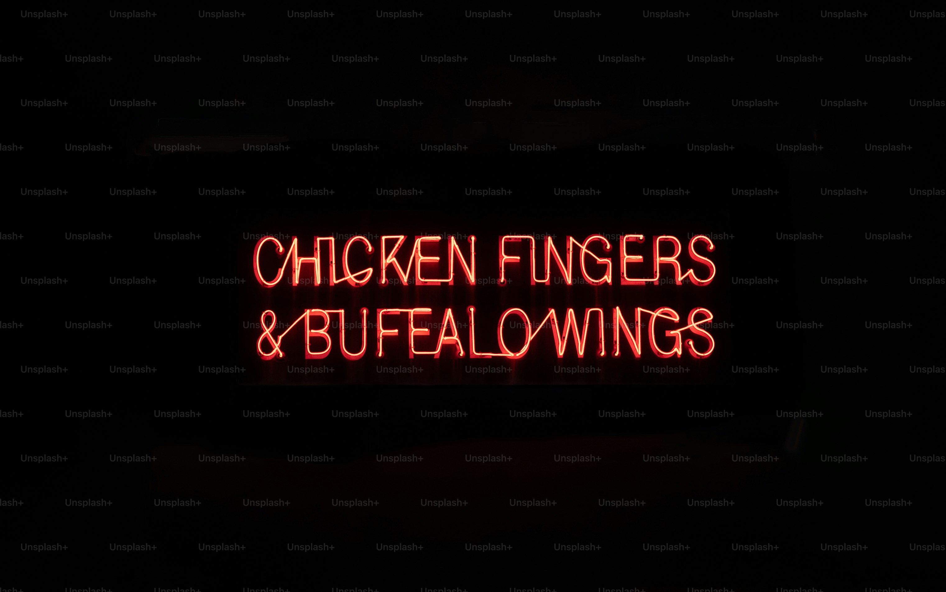 A neon sign that says chicken fingers and buffalo wings photo – Neon ...
