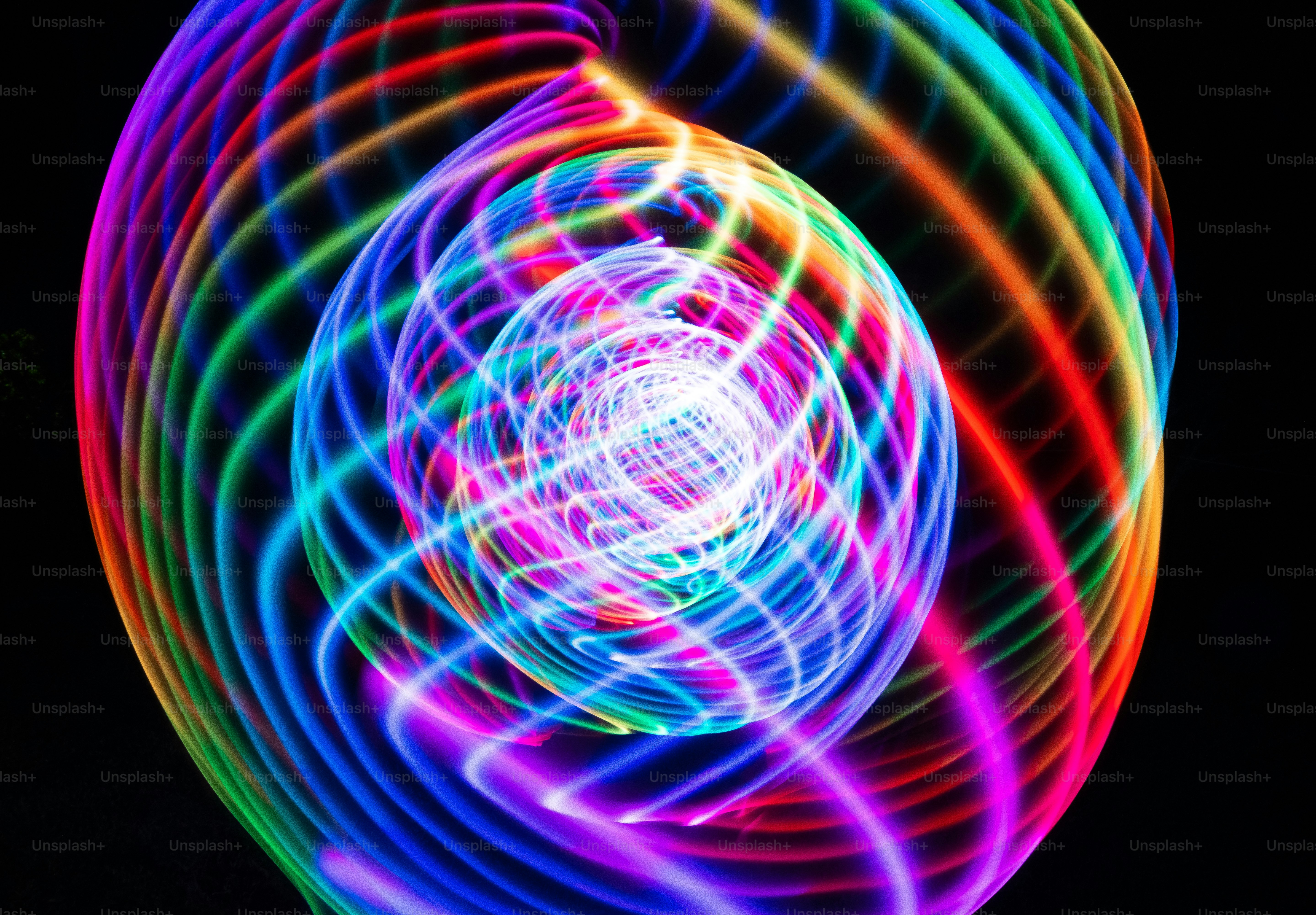A colorful swirl of light in the middle of the image photo – Light ...
