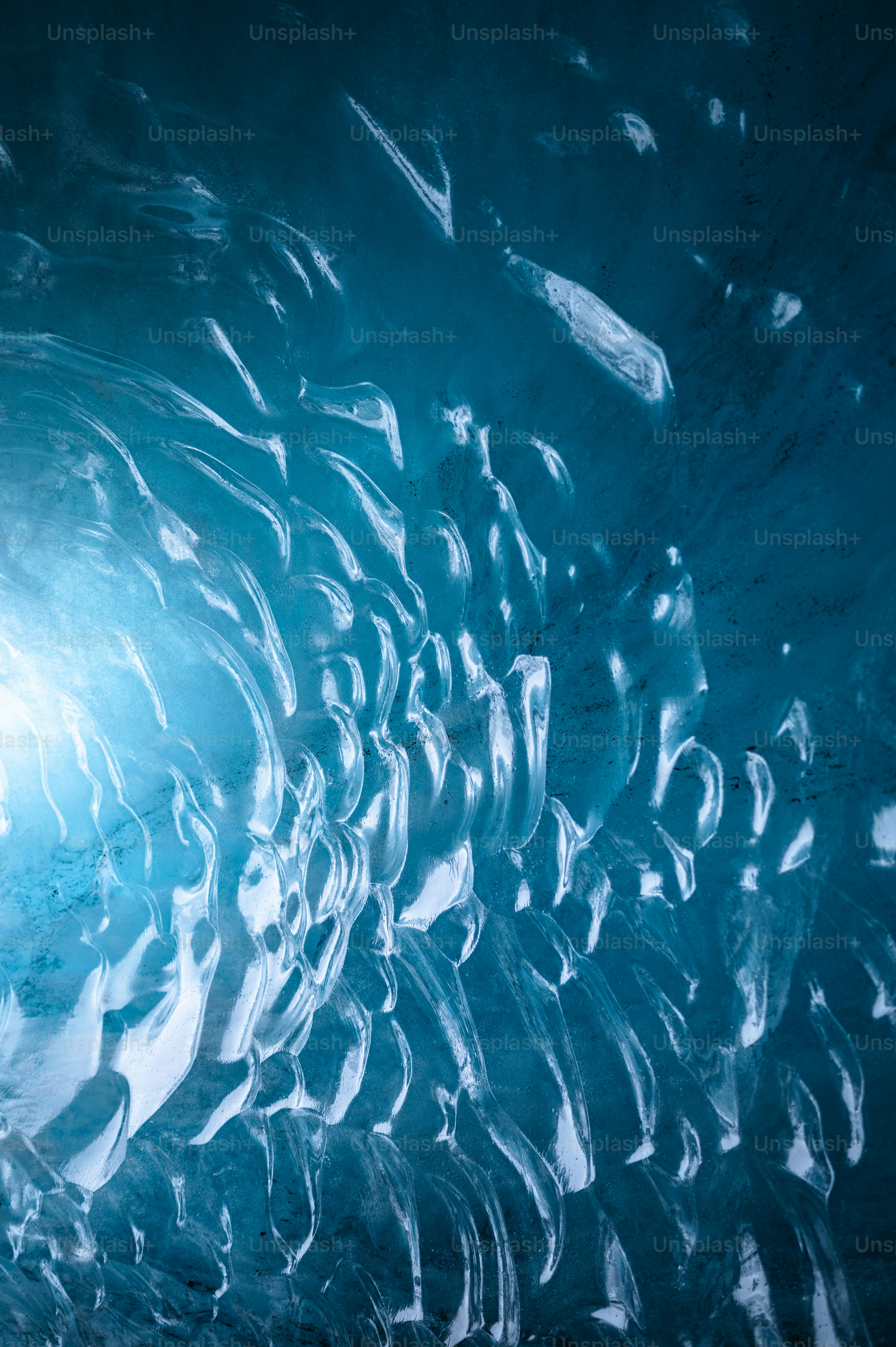 A large ice cave filled with lots of water photo – Screen saver Image ...
