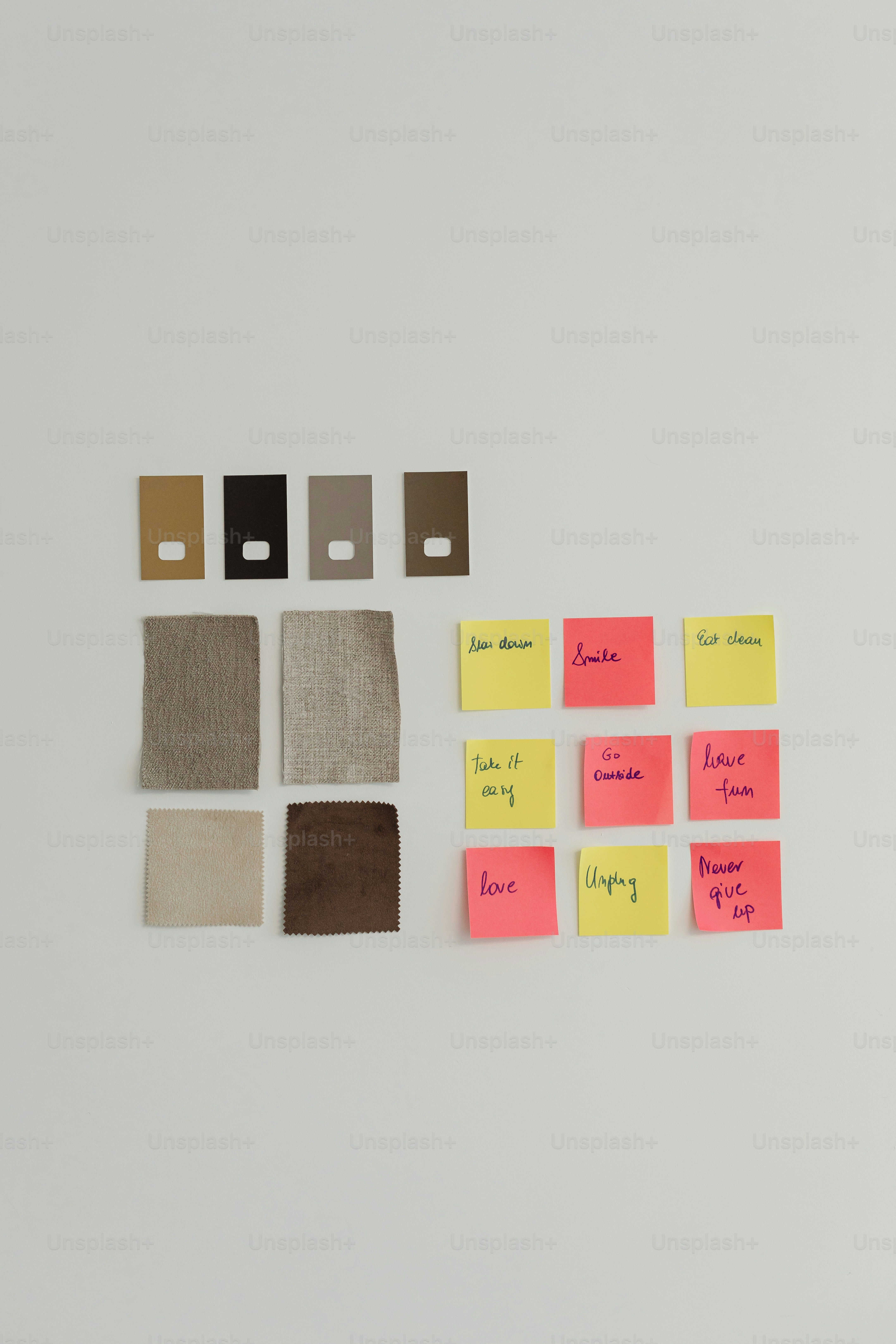 A white wall with sticky notes attached to it photo – Motivational ...