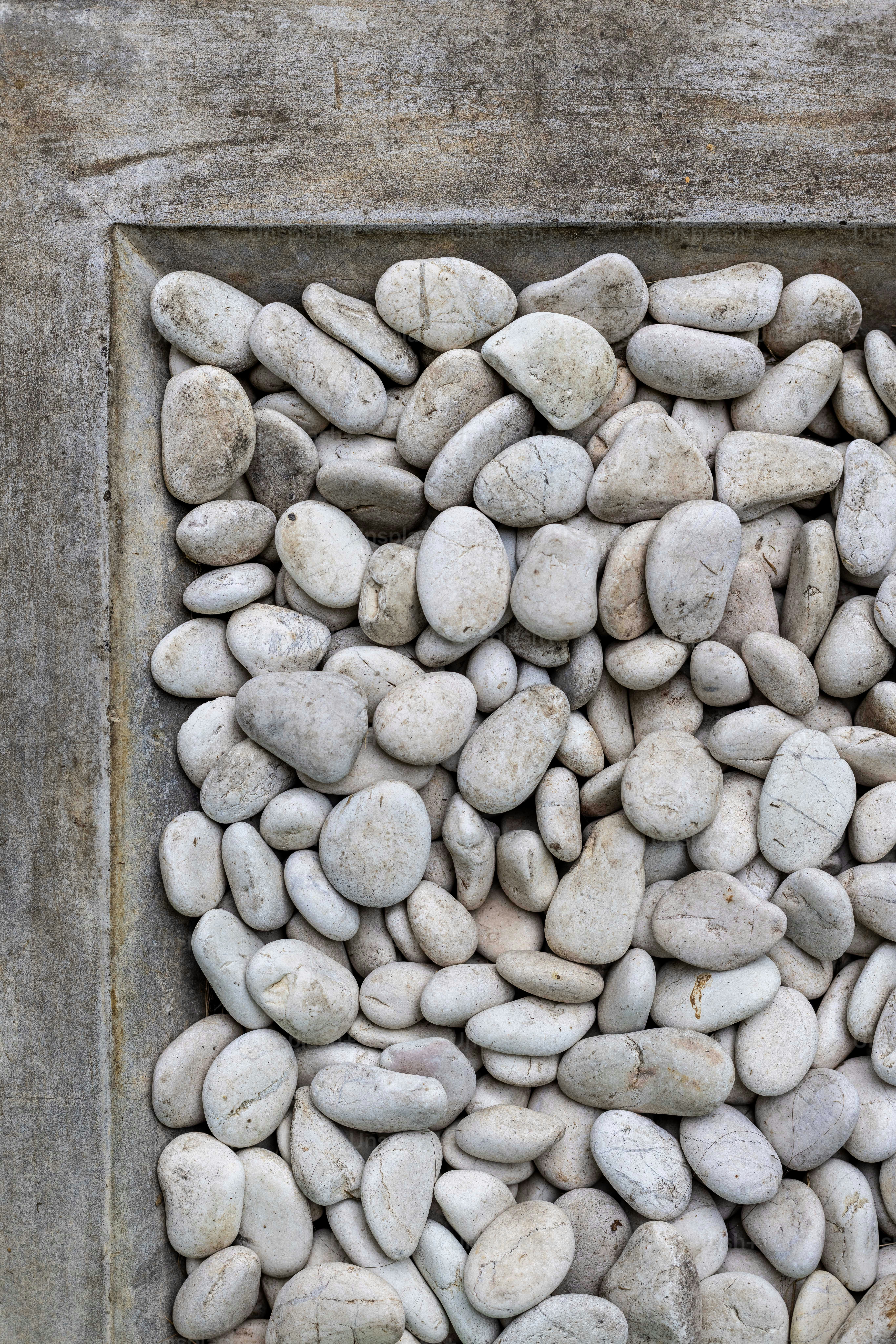 A bunch of rocks that are in a box photo – Texture Image on Unsplash