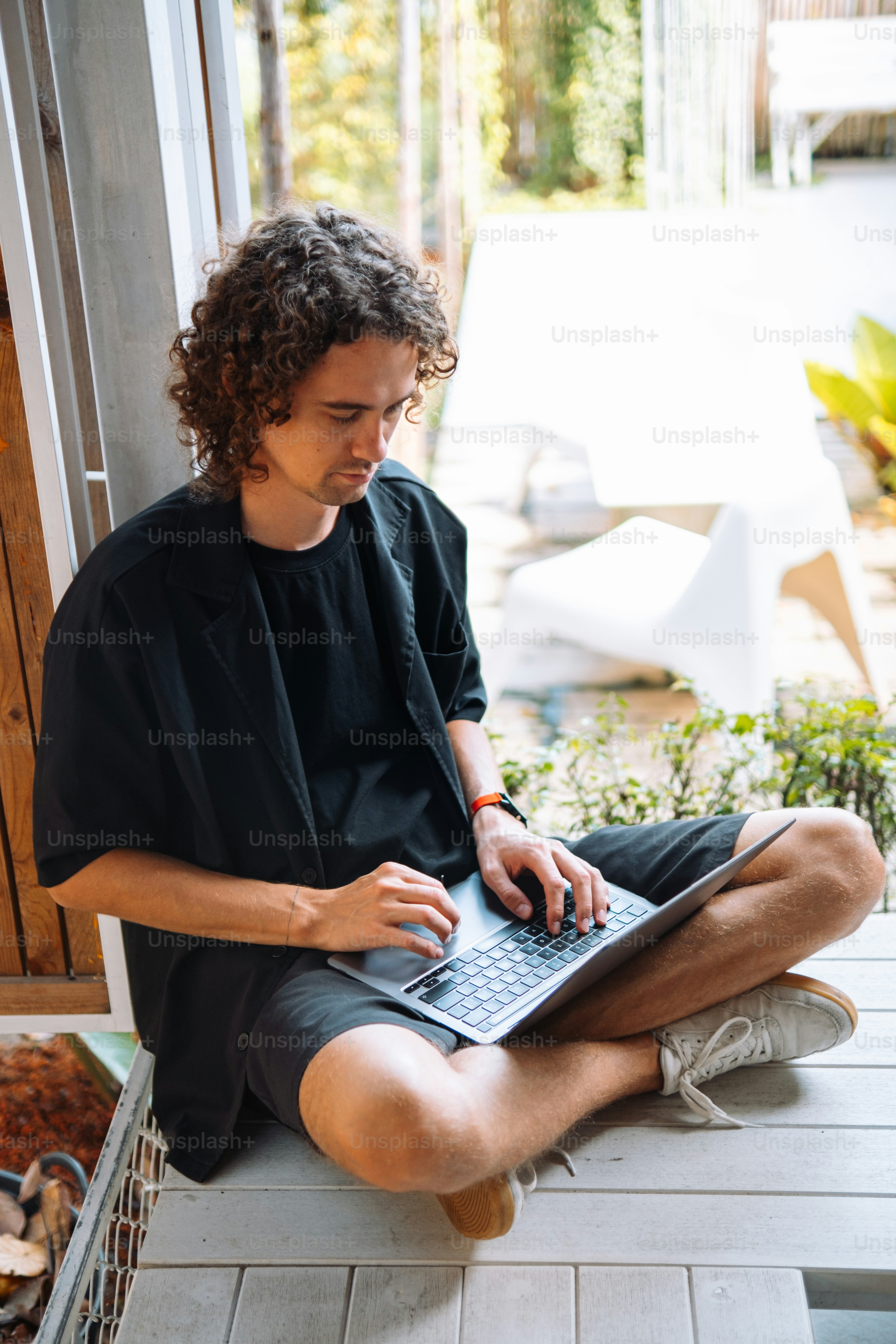 A person holding a laptop with a white screen photo – Laptop mockup ...