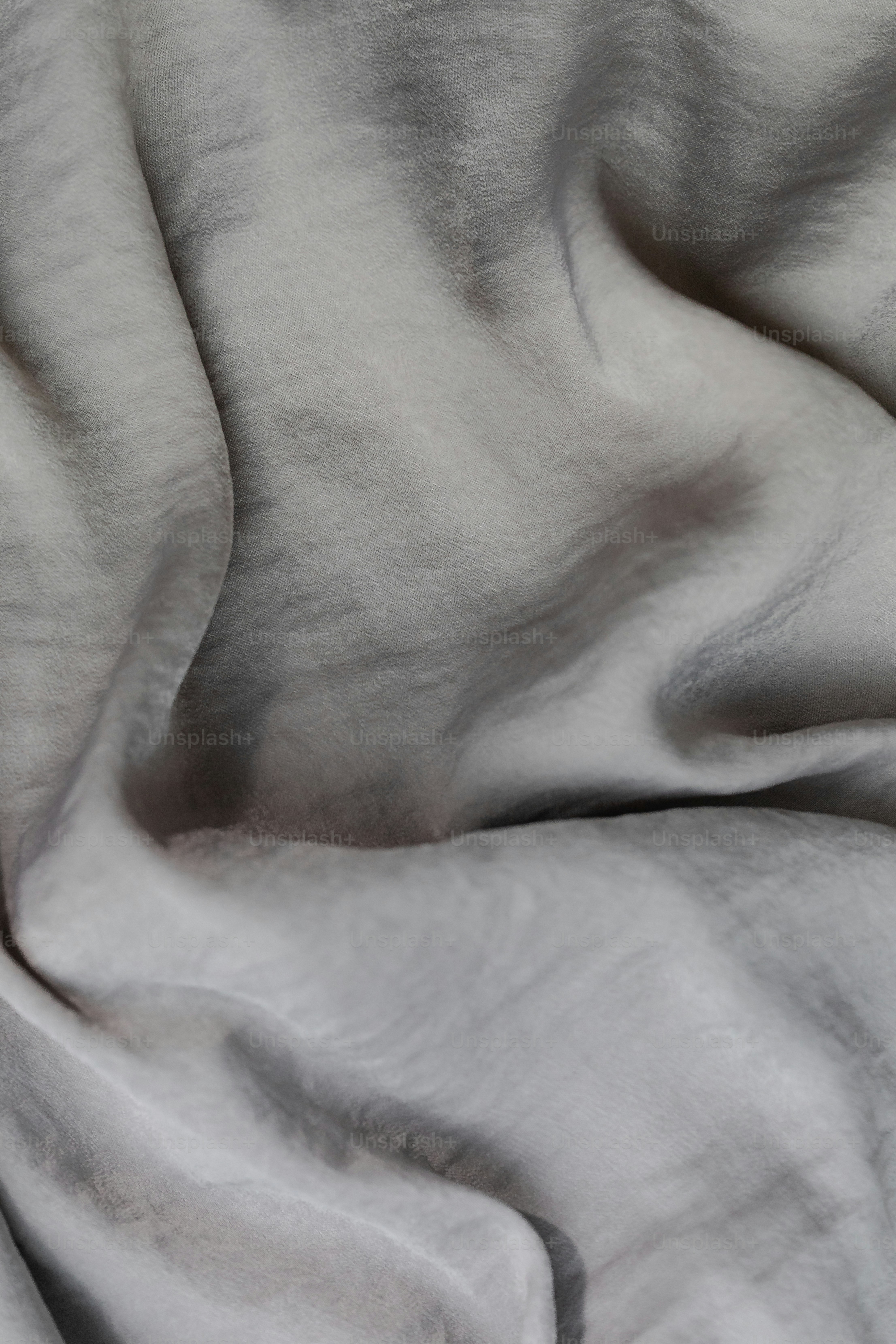 A close up of a bed with white sheets photo – Background Image on Unsplash