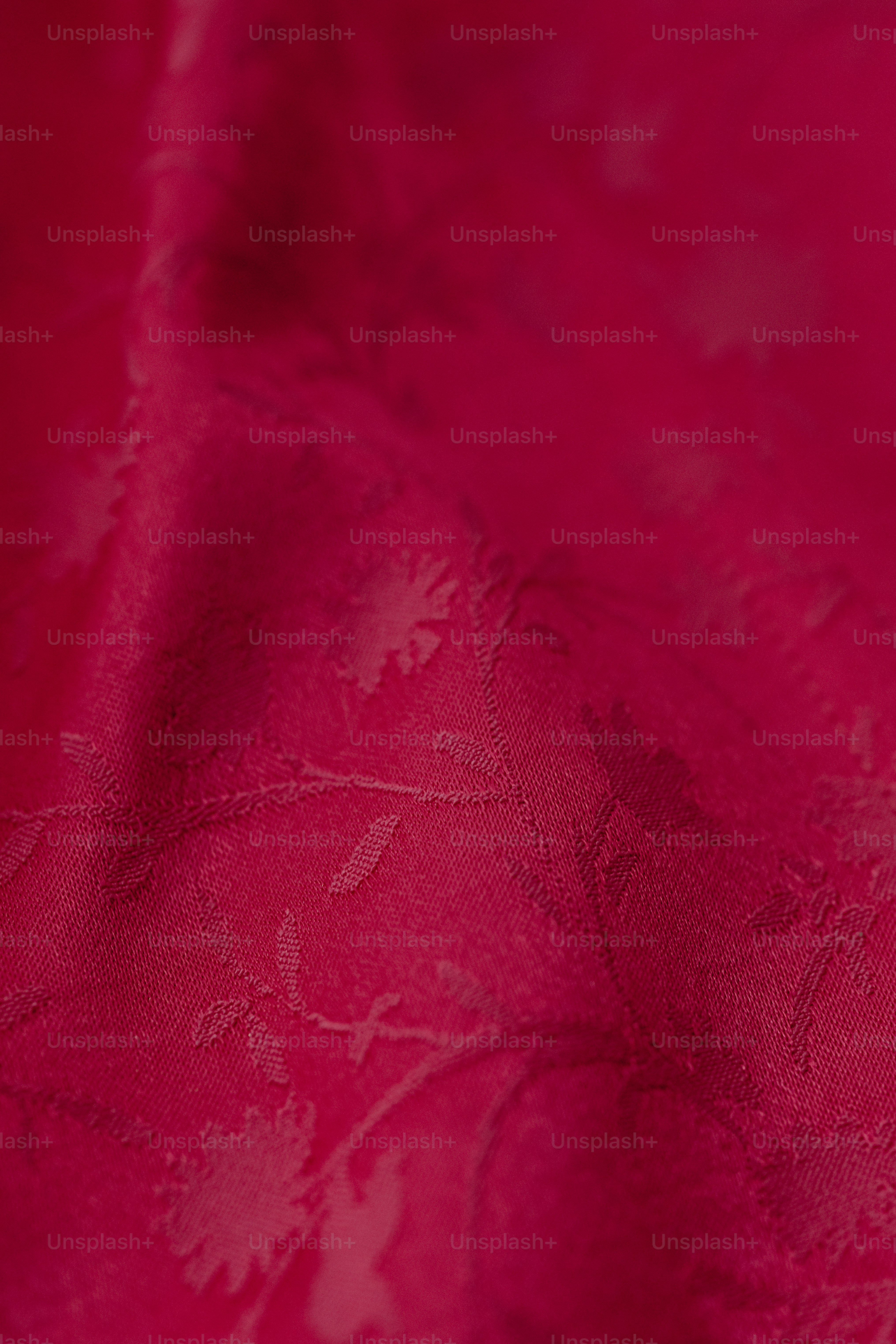A close up of a red cloth with a flower pattern photo – Texture Image ...