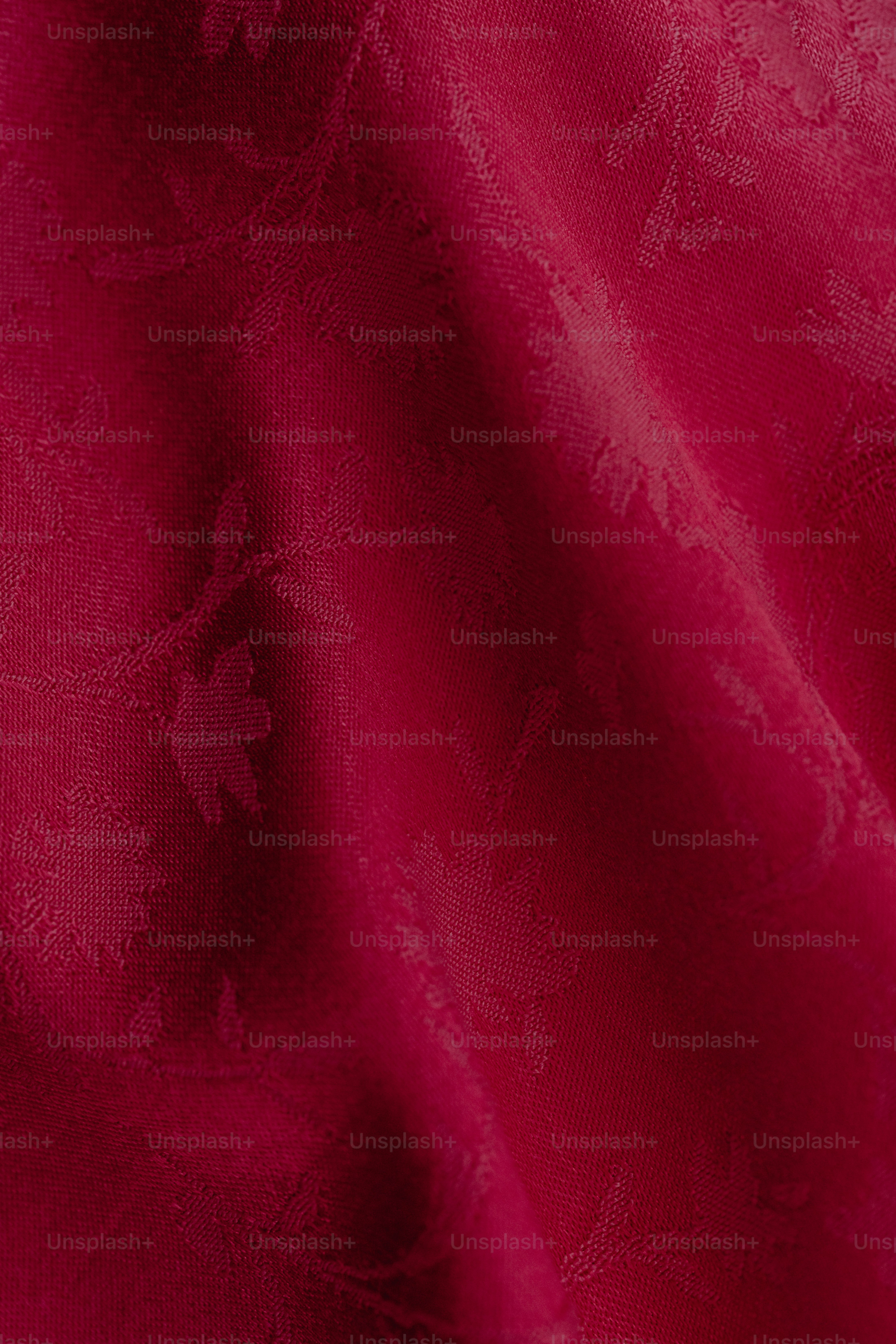 A close up of a red fabric with a flower pattern photo – Red fabric ...