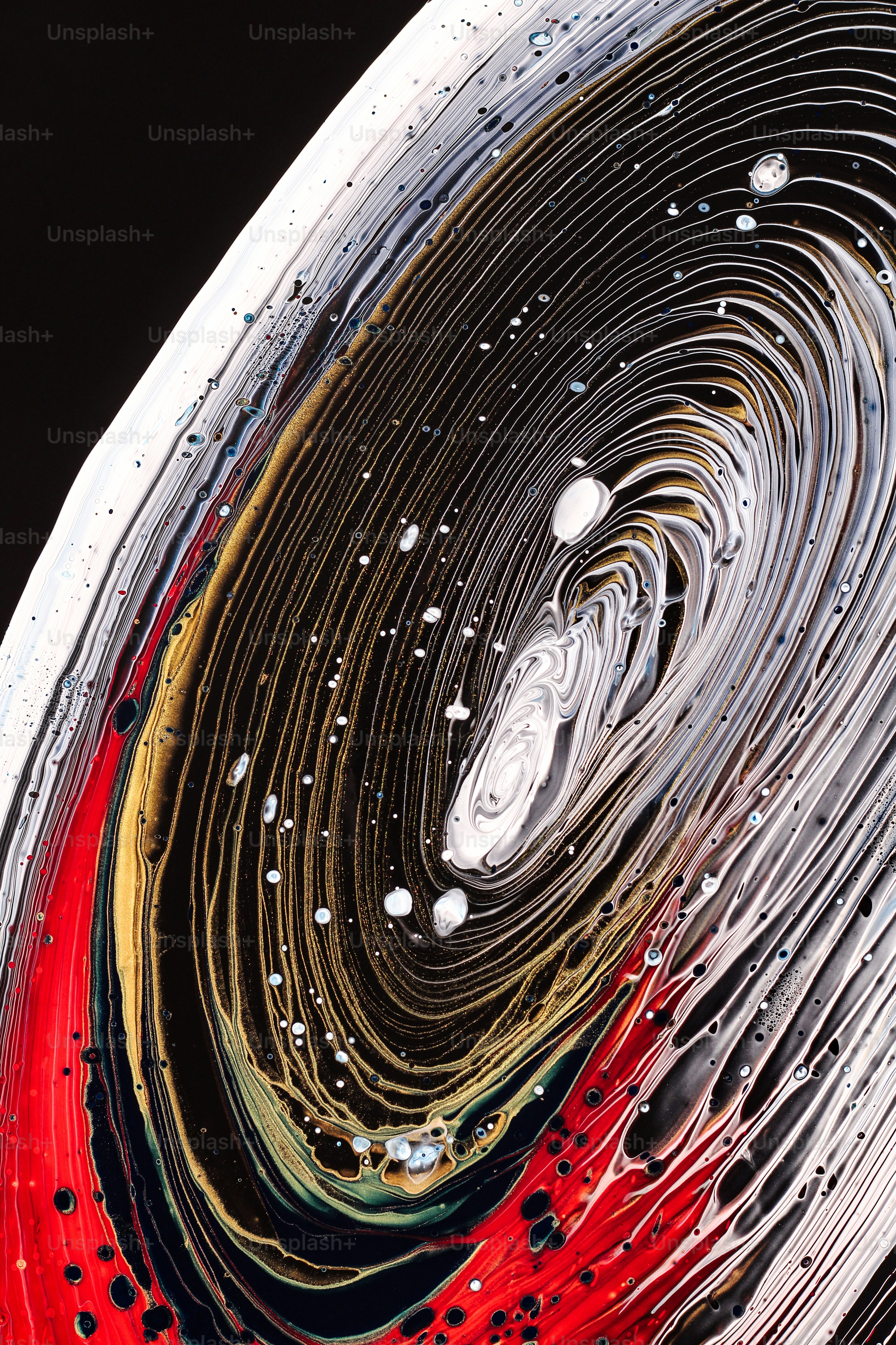 A close up of a circular object with drops of water on it photo ...