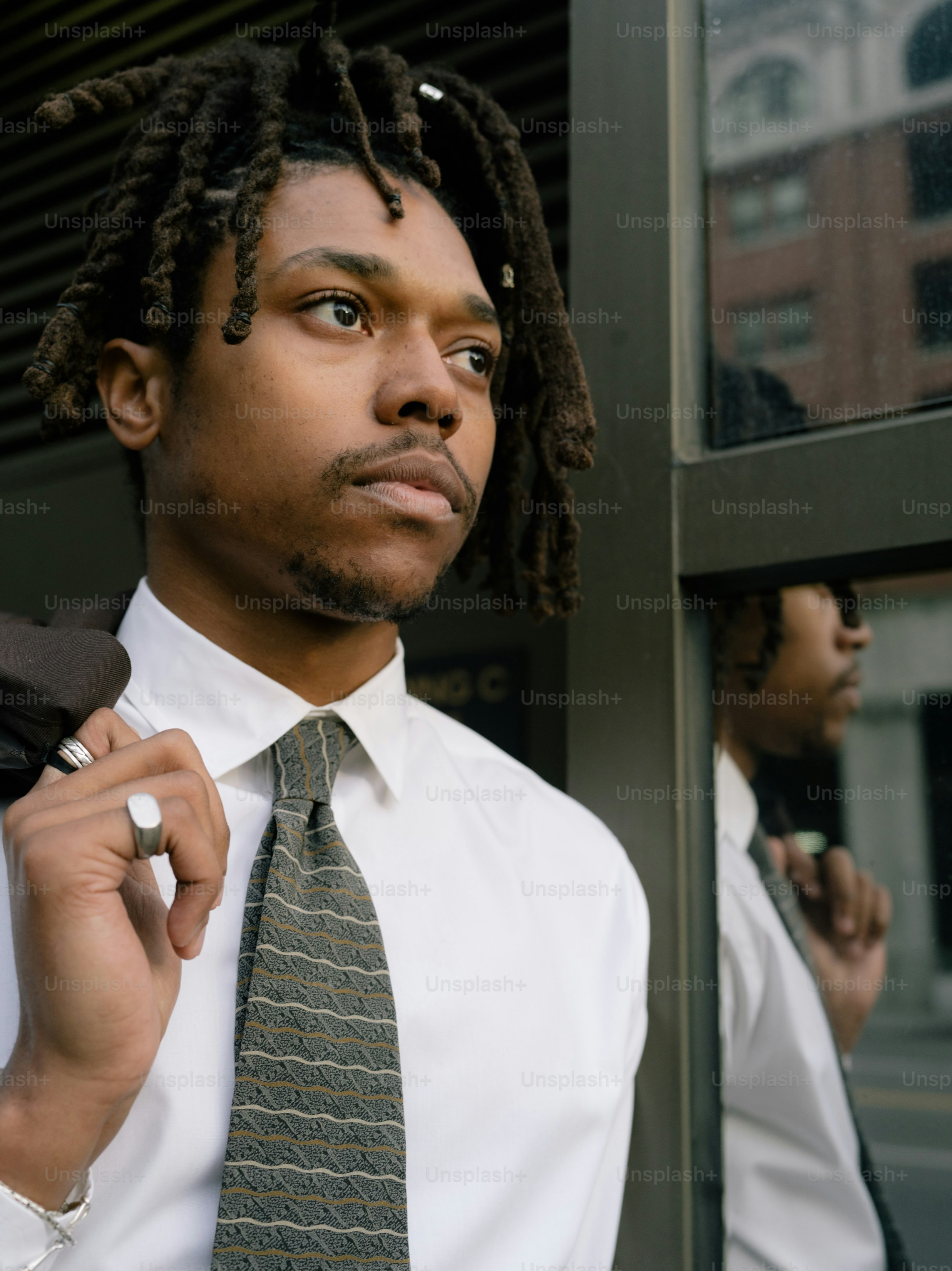 A man with dreadlocks wearing a white shirt and tie photo – Business ...
