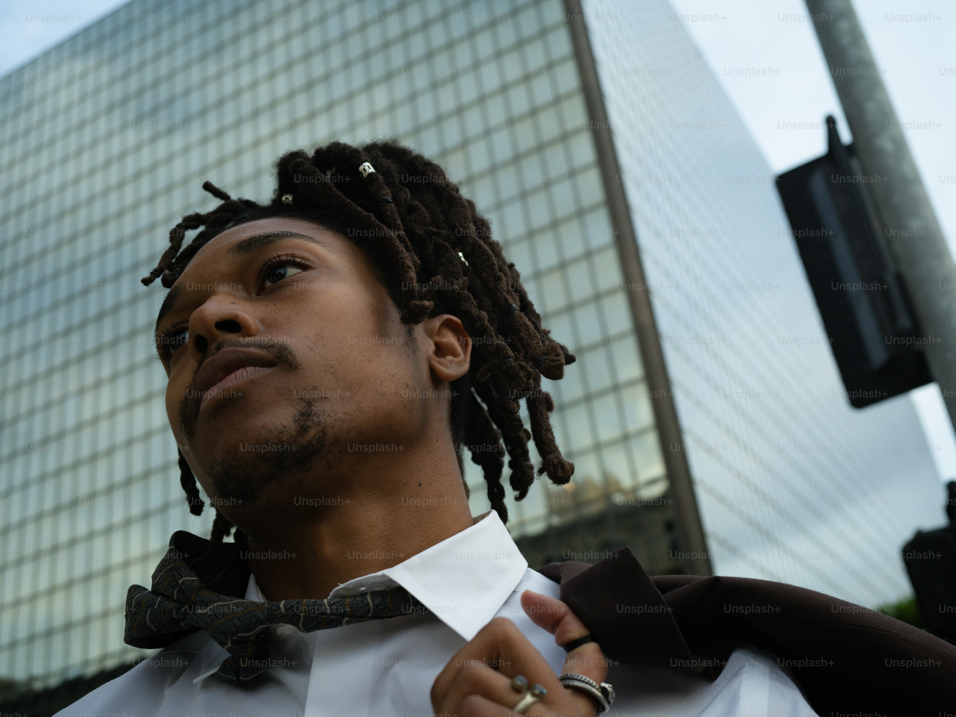 A man with dreadlocks wearing a white shirt and tie photo – Fashion ...