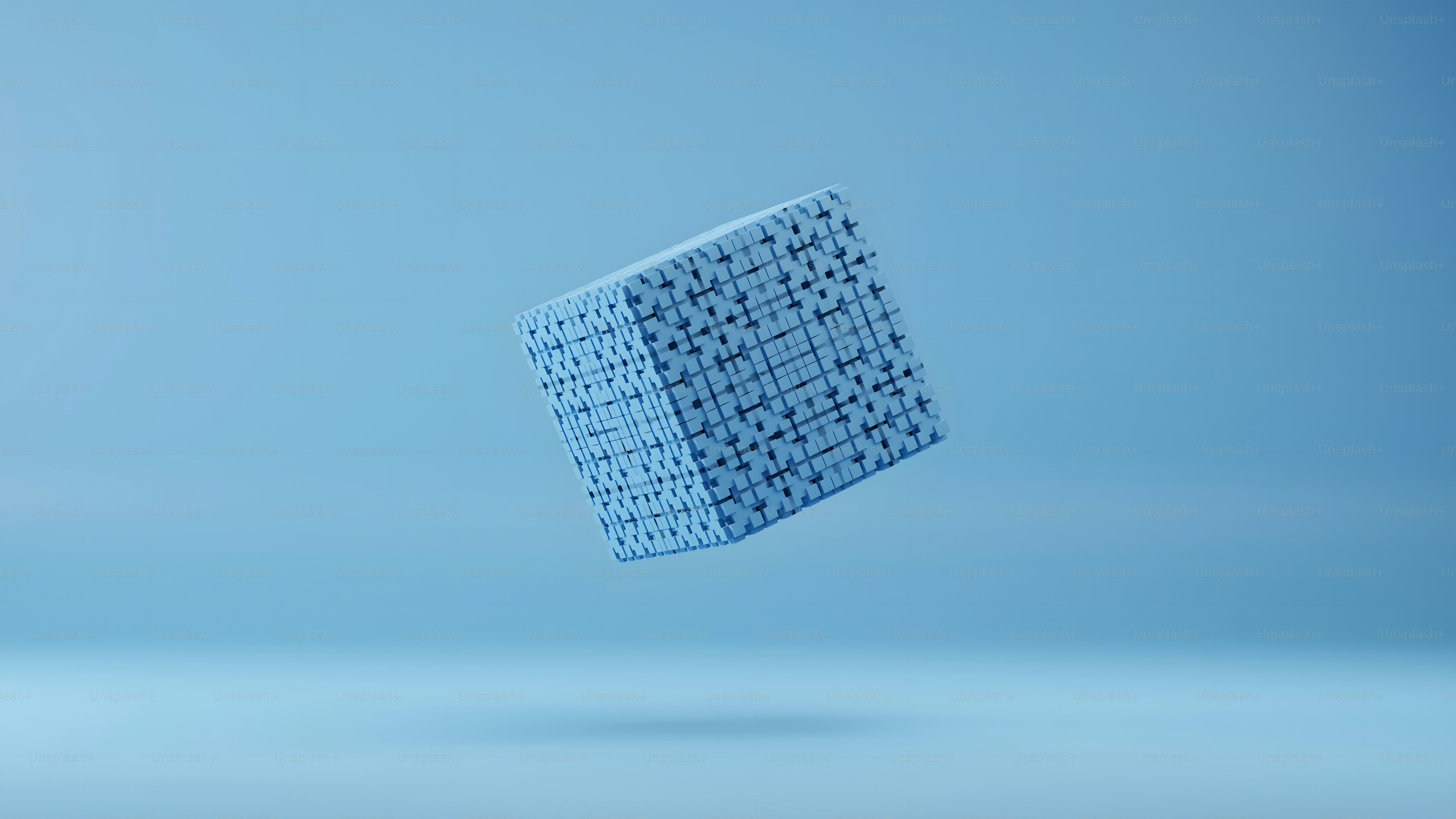 A blue square object floating in the air photo – Block Image on Unsplash