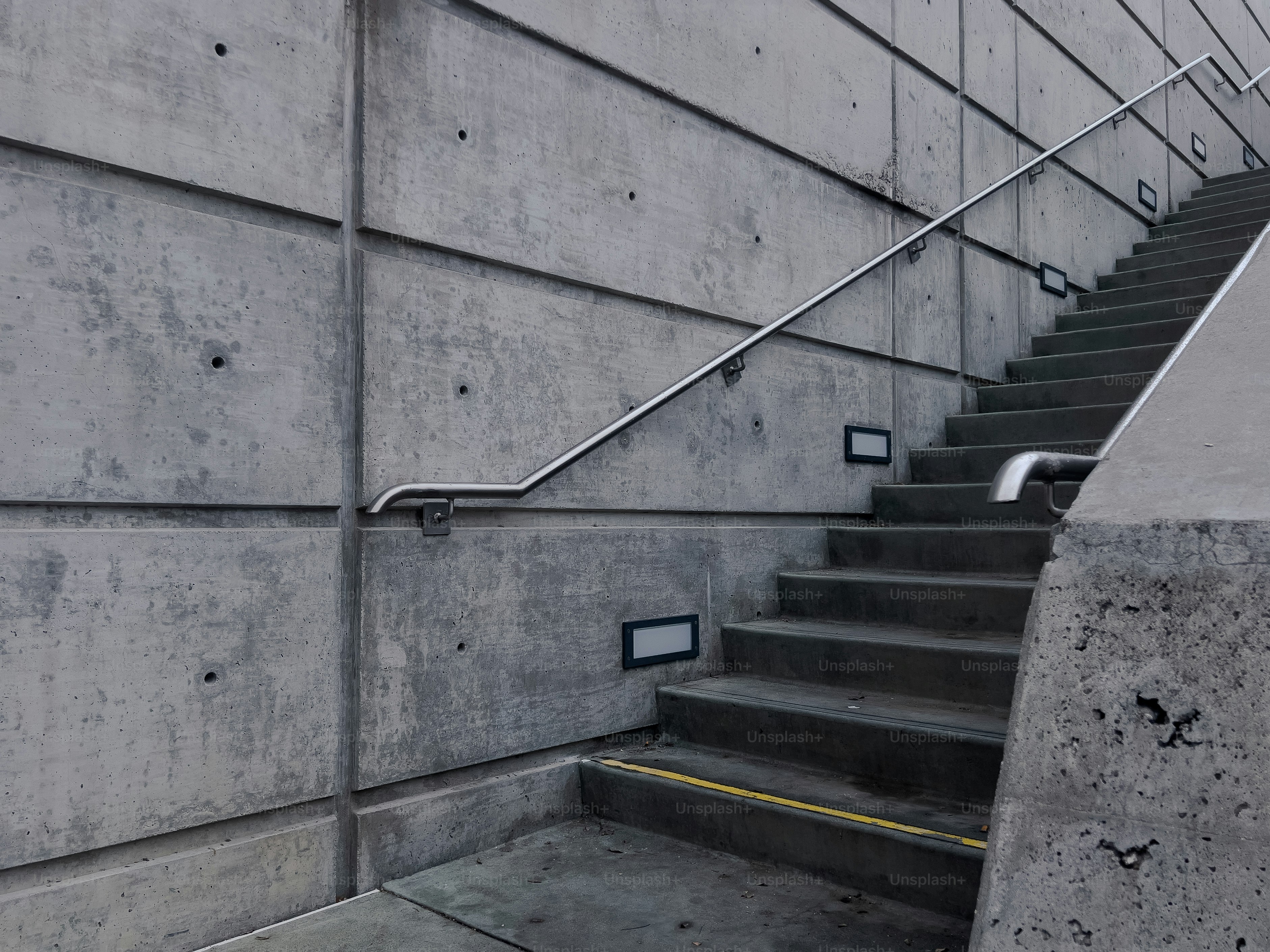 A set of stairs leading up to a cement wall photo – Los angeles Image ...