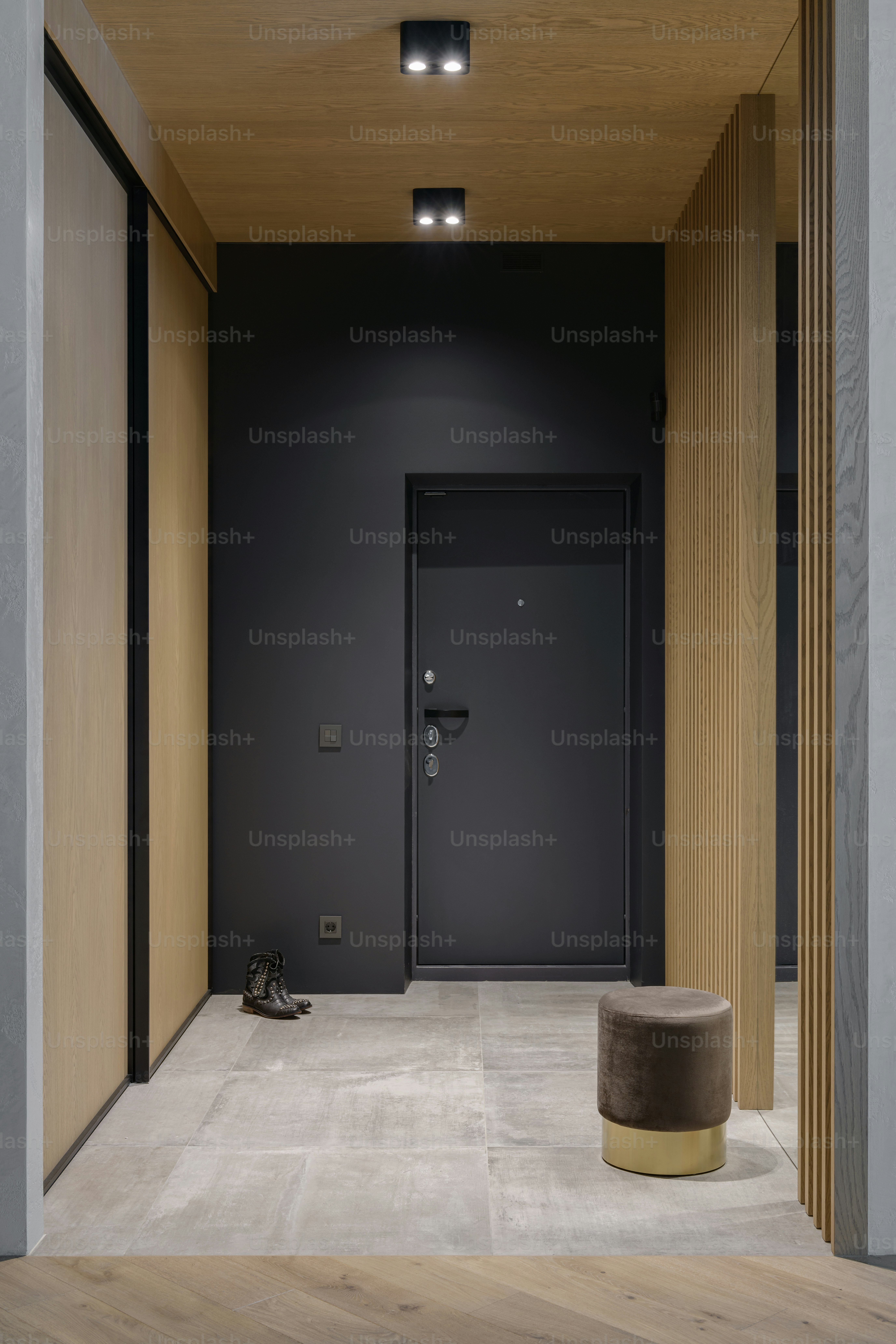 A hallway with a door and a footstool photo – Interior design Image on ...