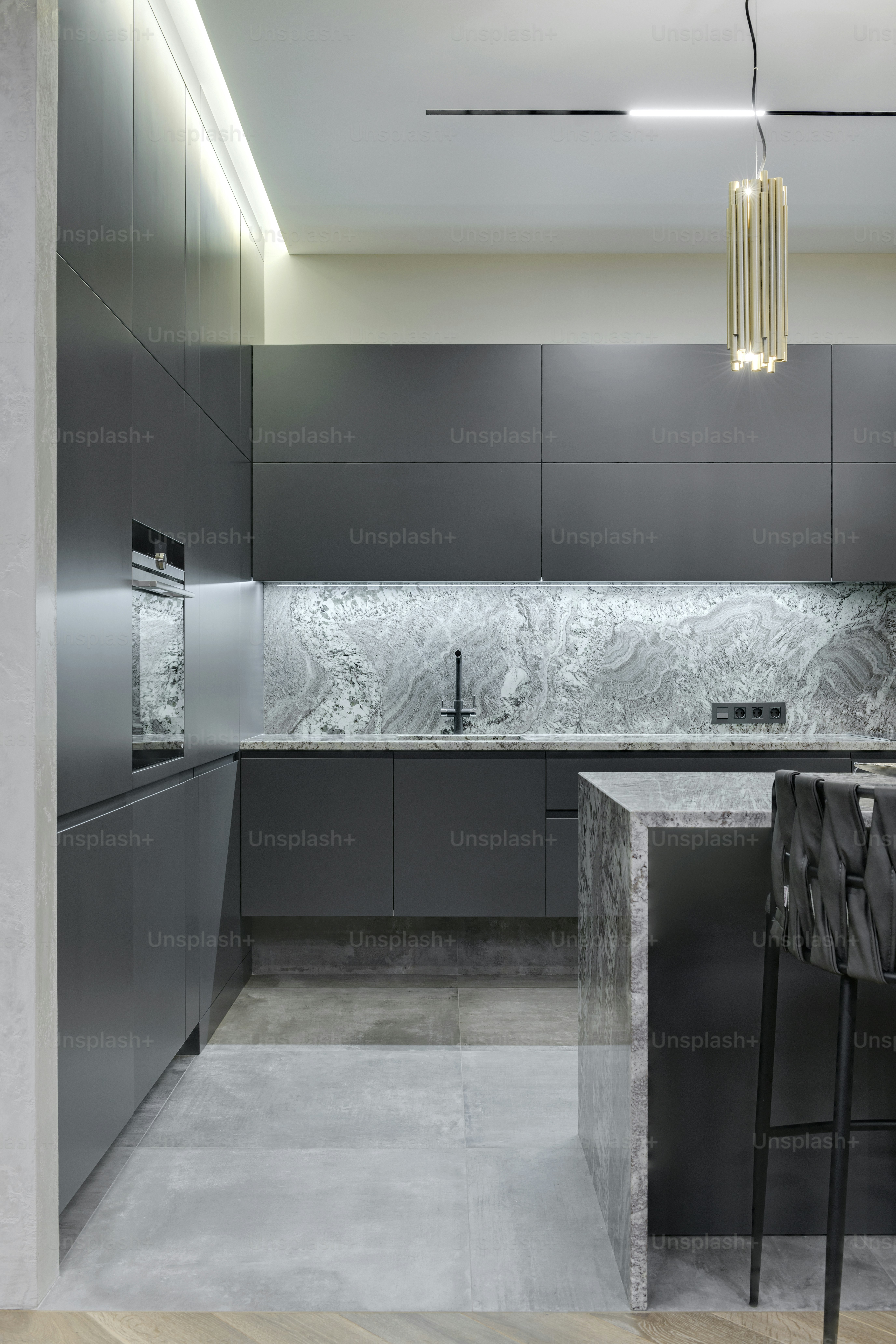 A modern kitchen with a marble counter top photo – Home decor Image on ...