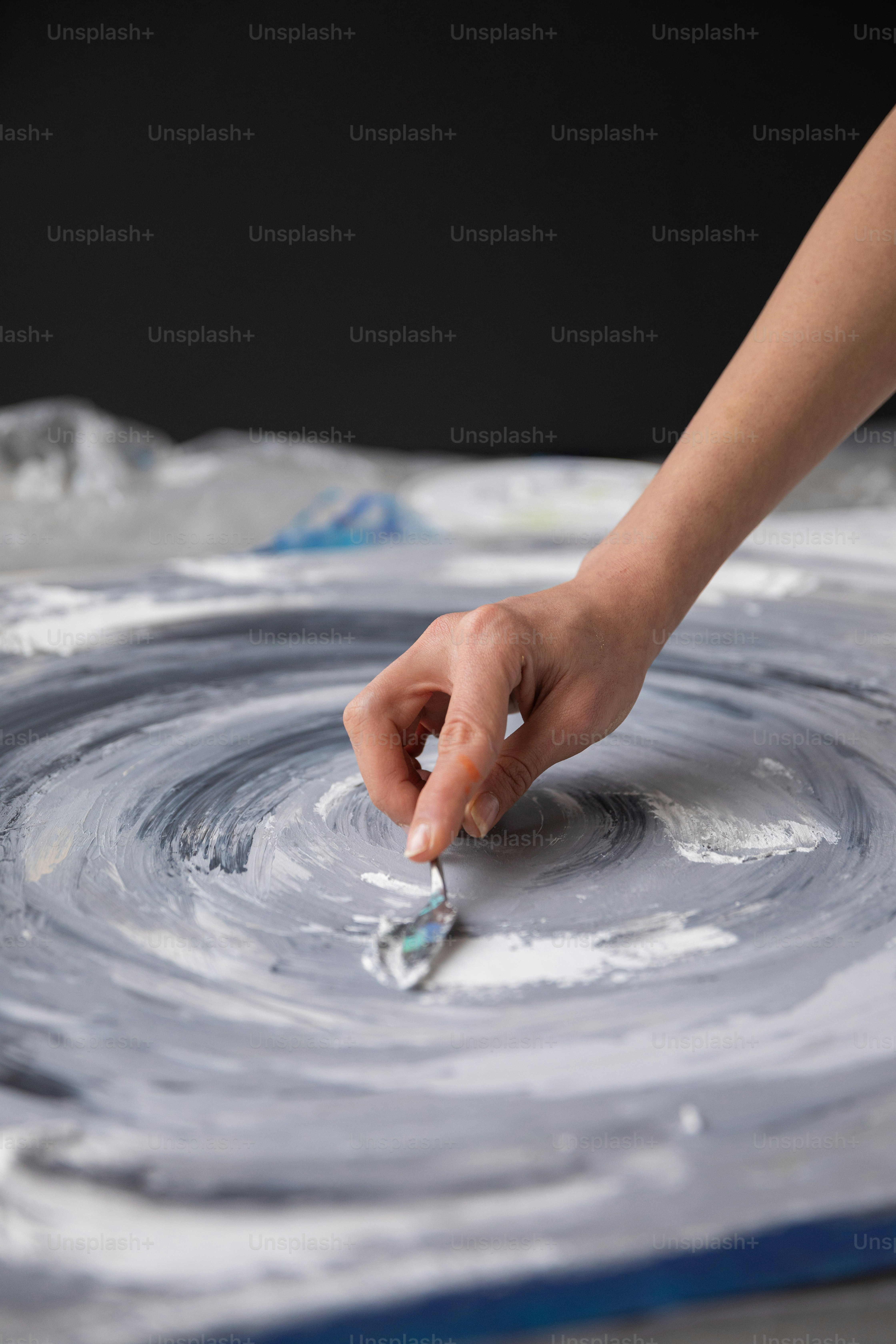 A person touching a piece of art with their hand photo – Making Image ...