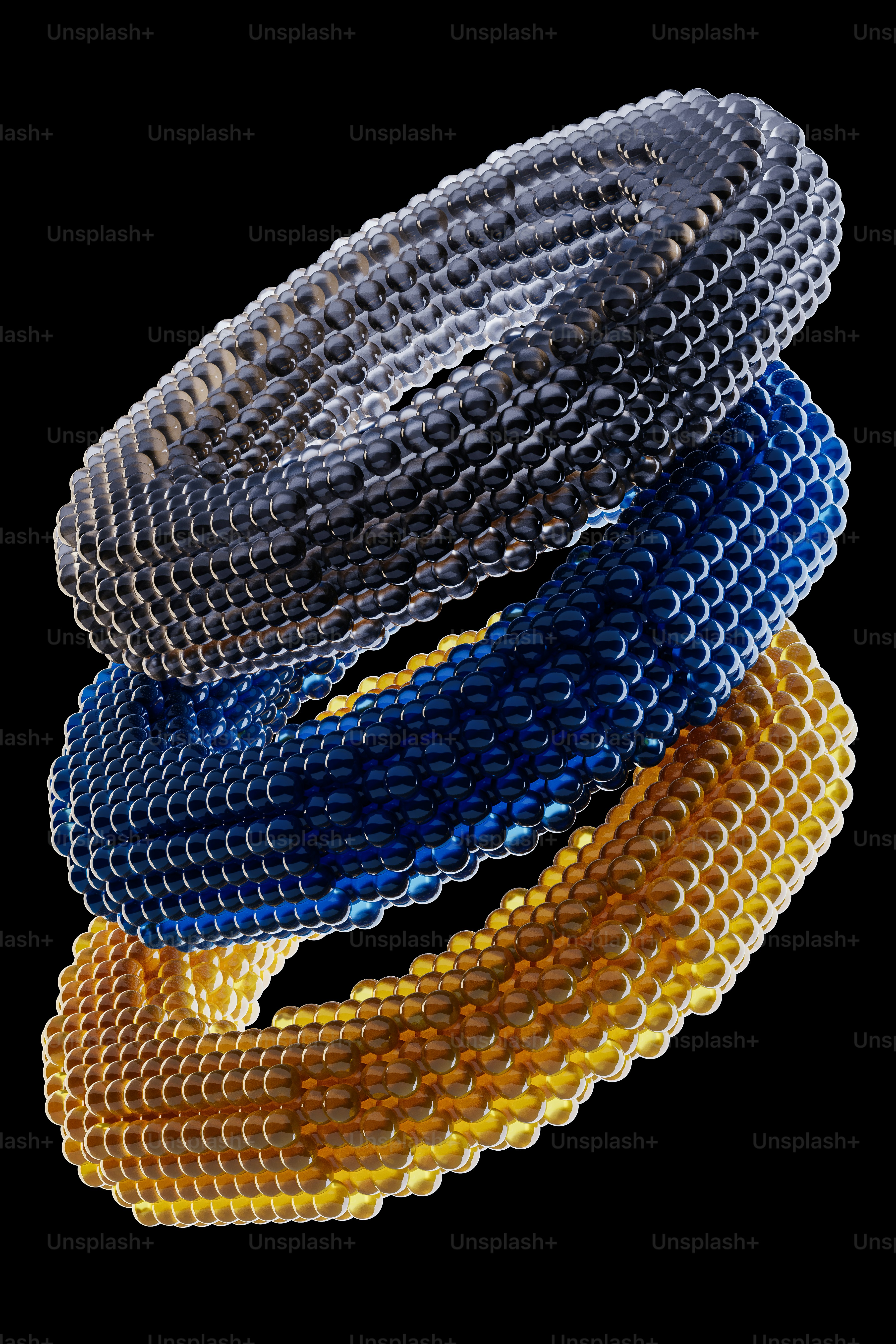 A stack of different colored discs on a black background photo ...