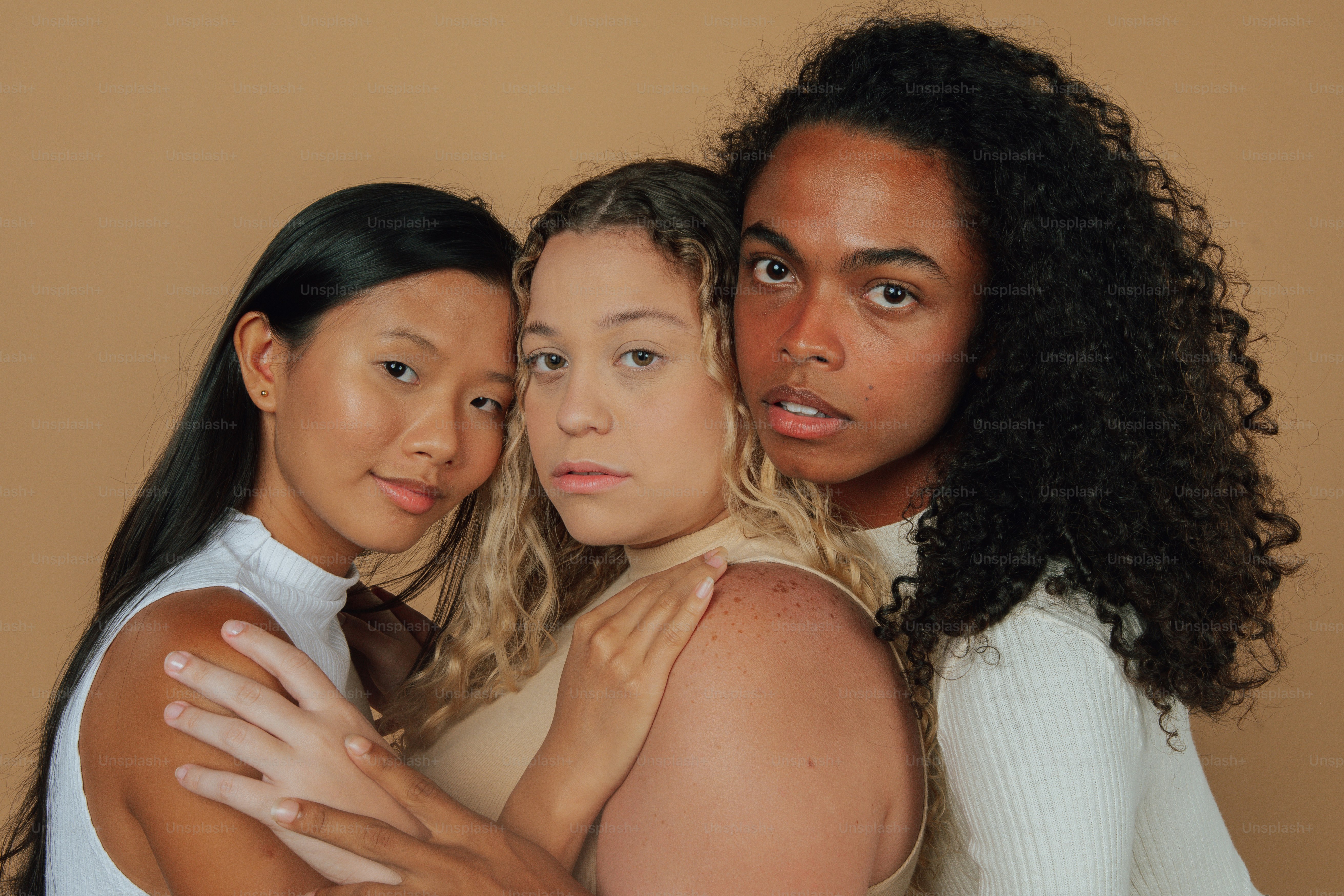 A group of three women standing next to each other photo – Three women ...