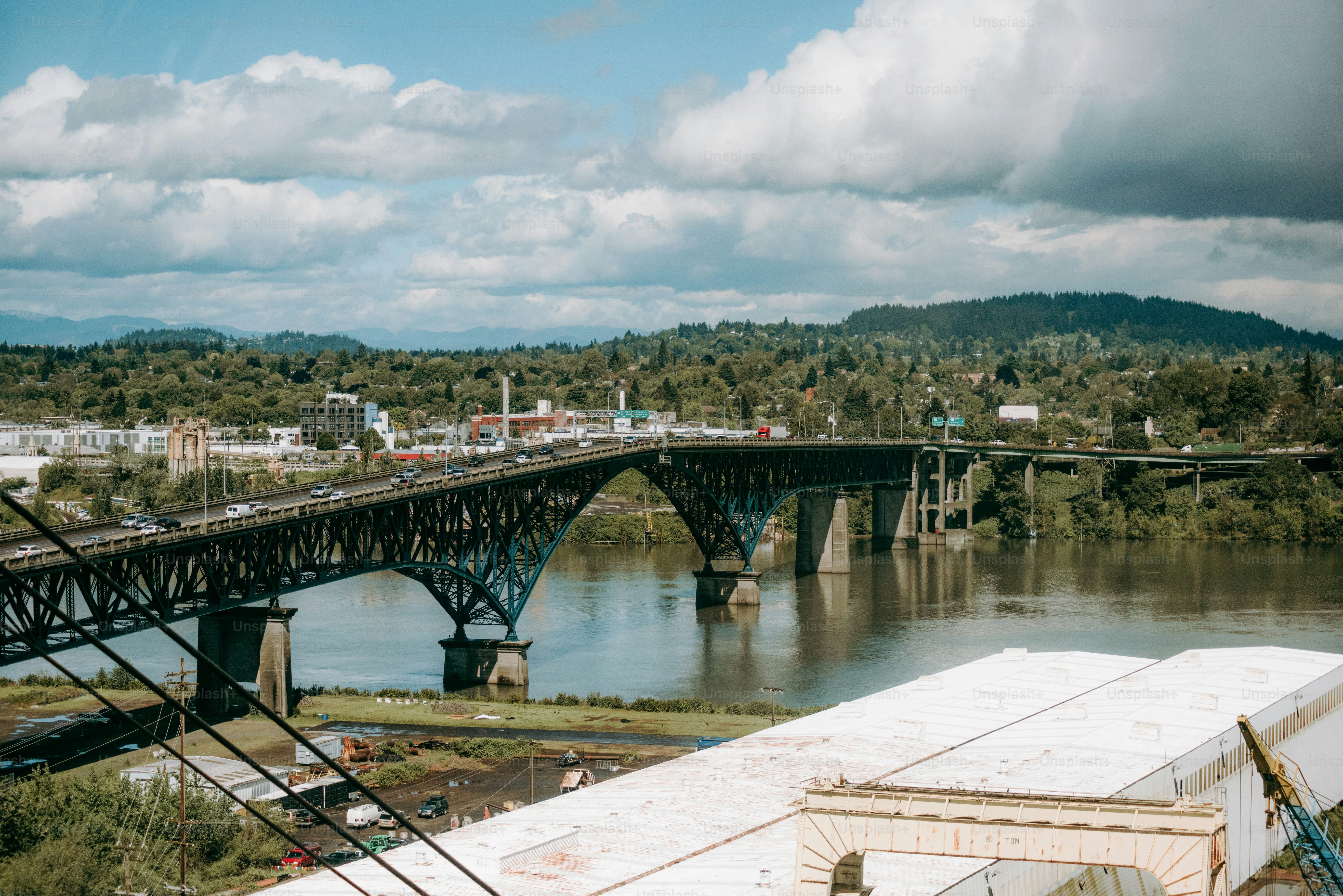 A view of a bridge over a body of water photo – Bridge Image on Unsplash