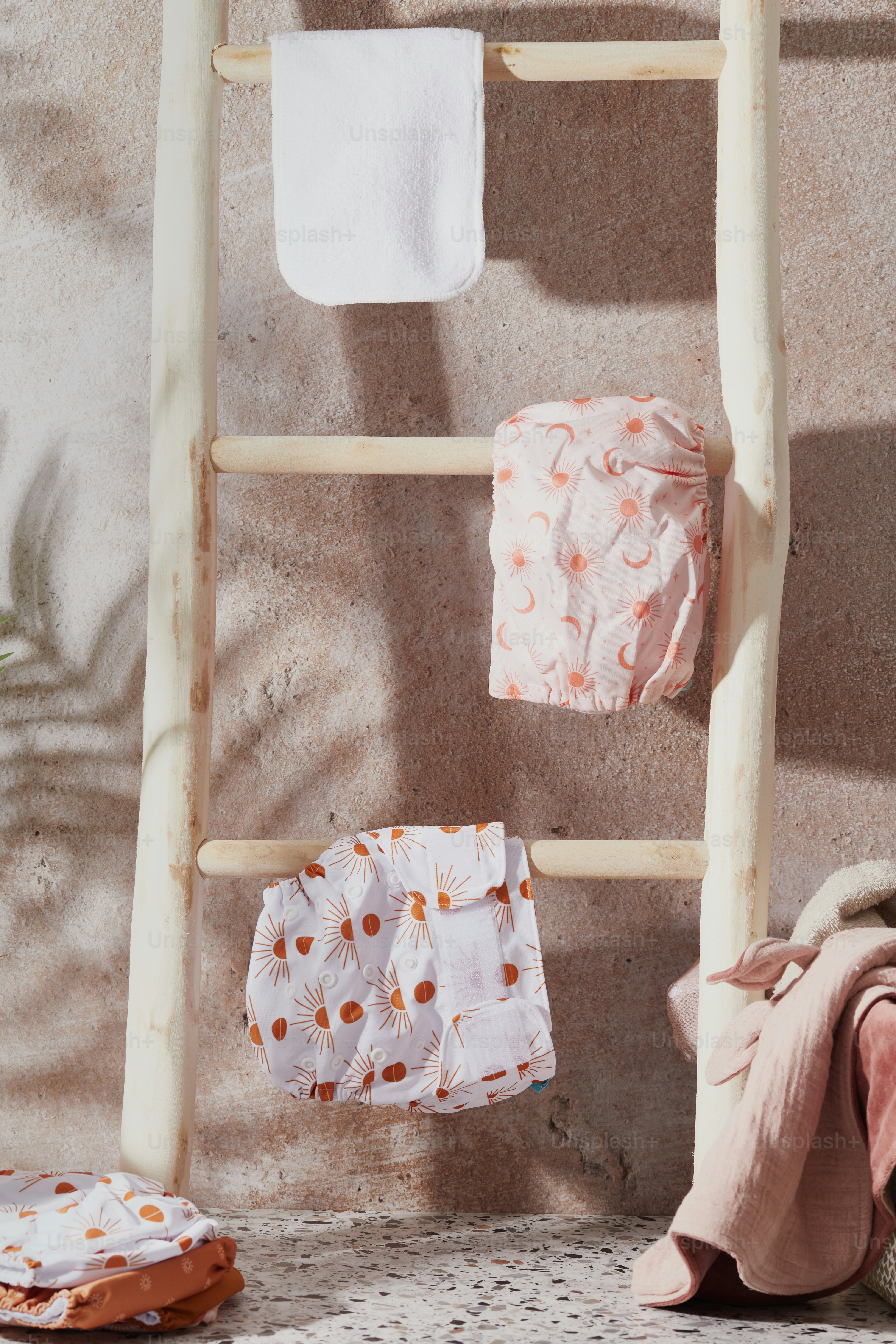 A pair of overalls hanging on a clothes rack photo – Kids clothing ...