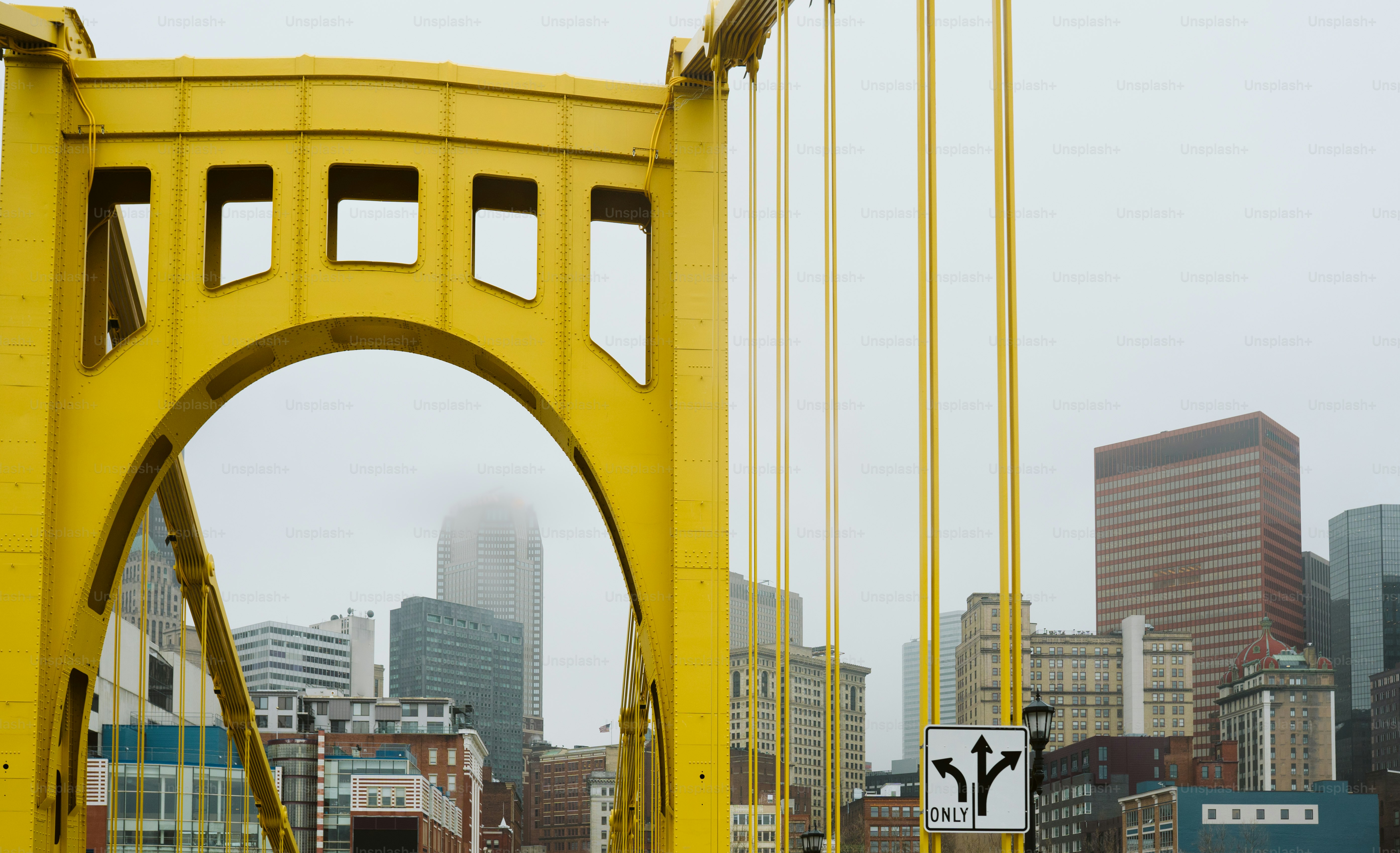 A view of a bridge with a city in the background photo – Pittsburgh ...