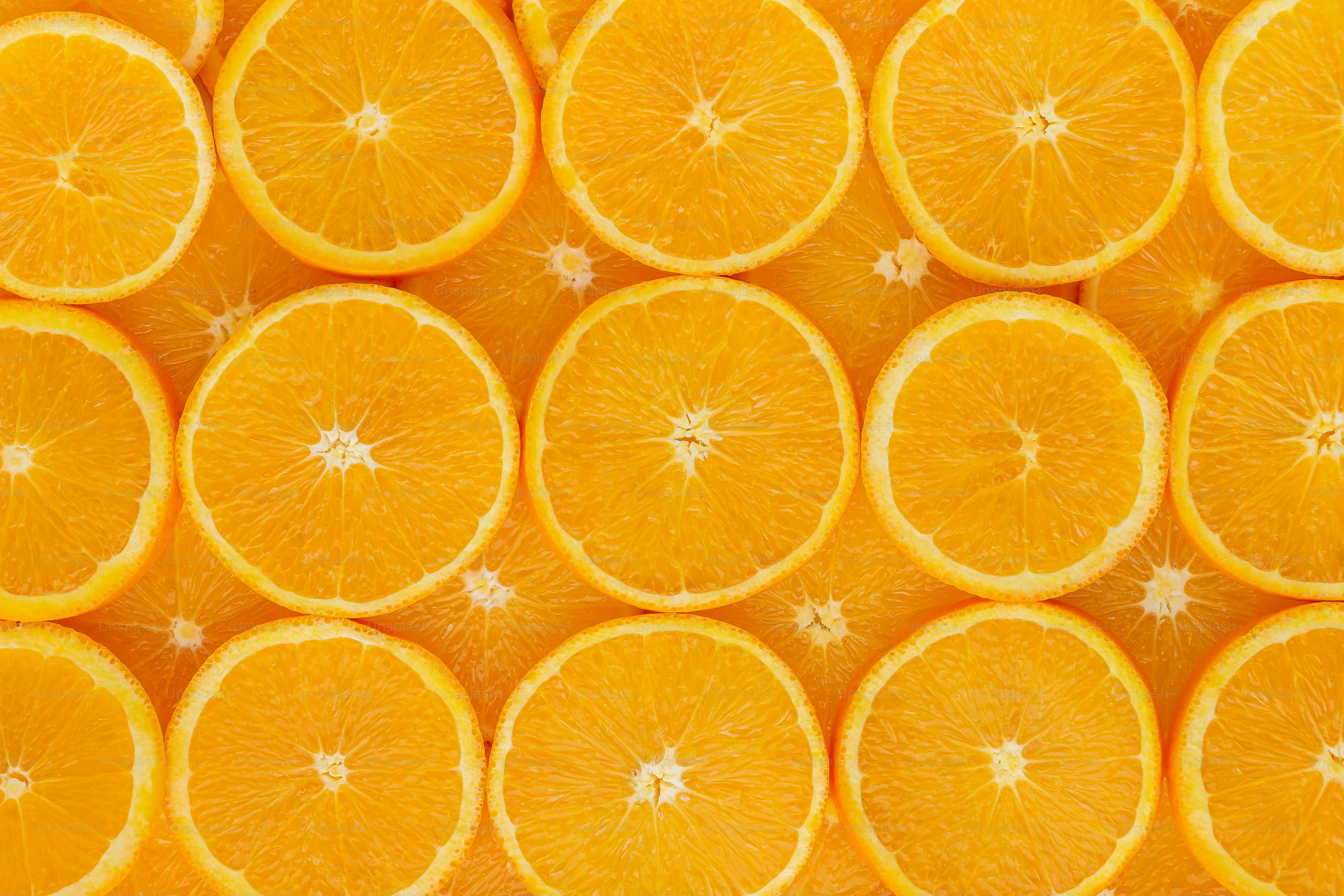 A bunch of oranges that are cut in half photo – Texture Image on Unsplash